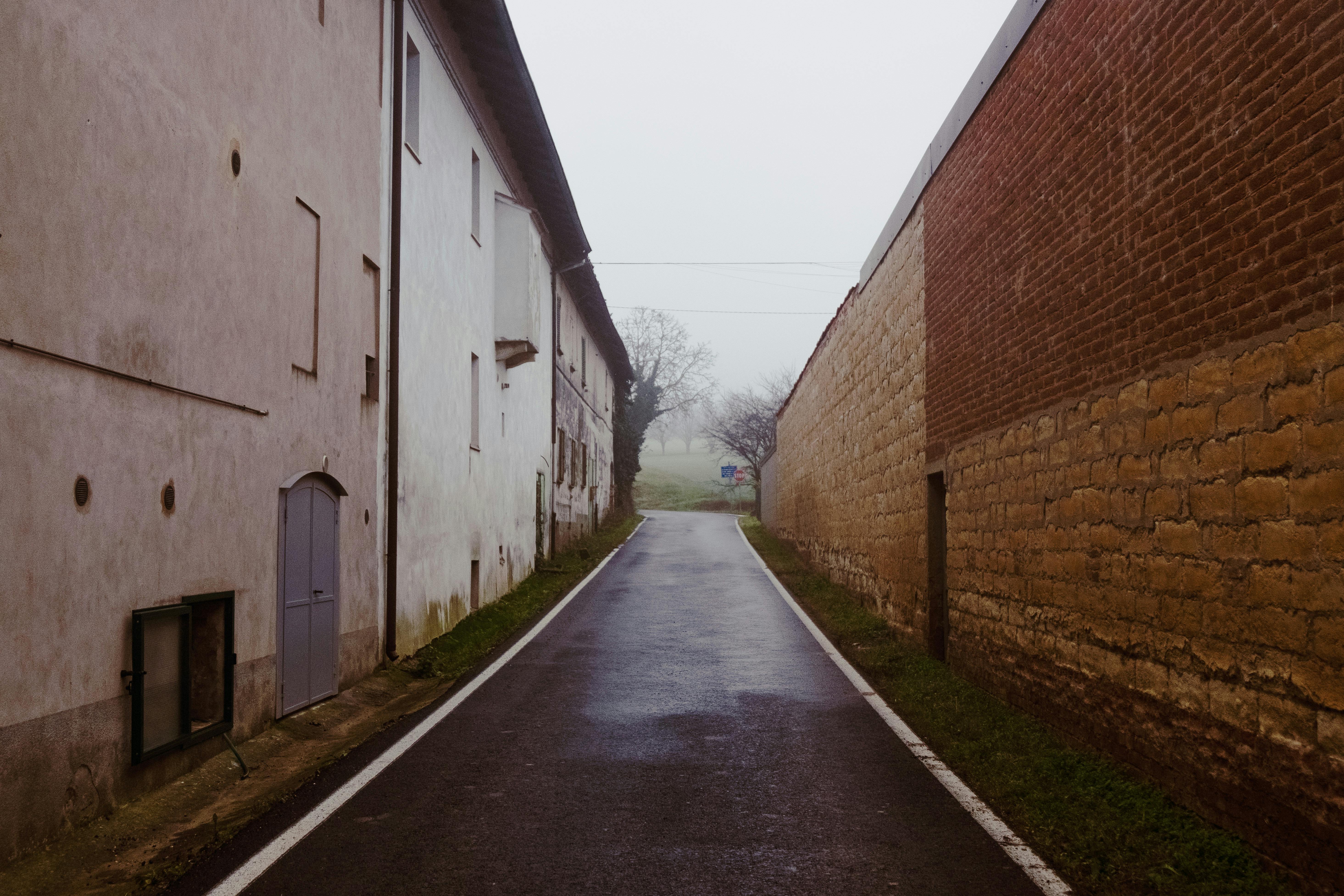Empty Road Between Houses · Free Stock Photo