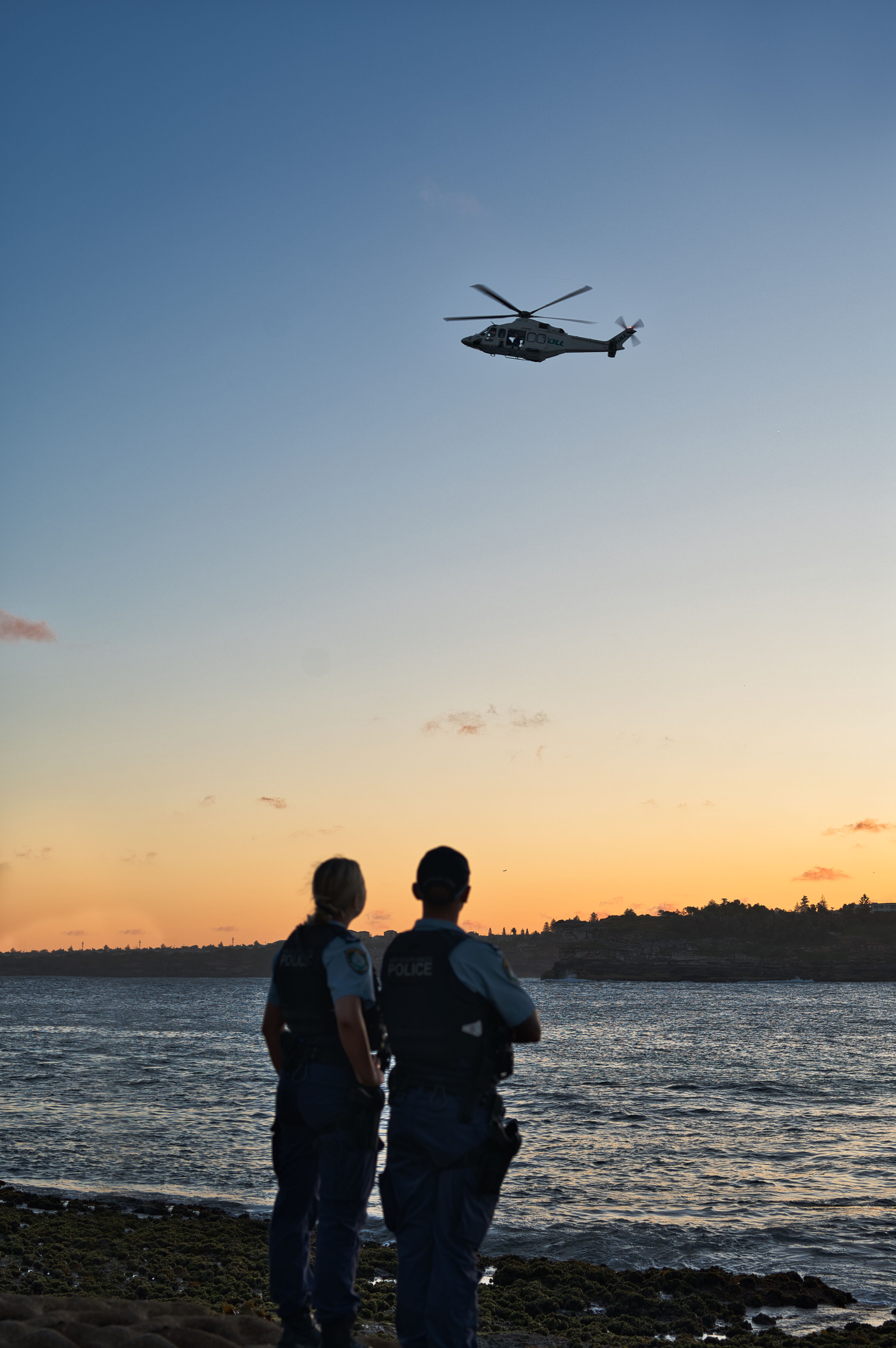 Police Officers Looking at Rescue Helicopter · Free Stock Photo