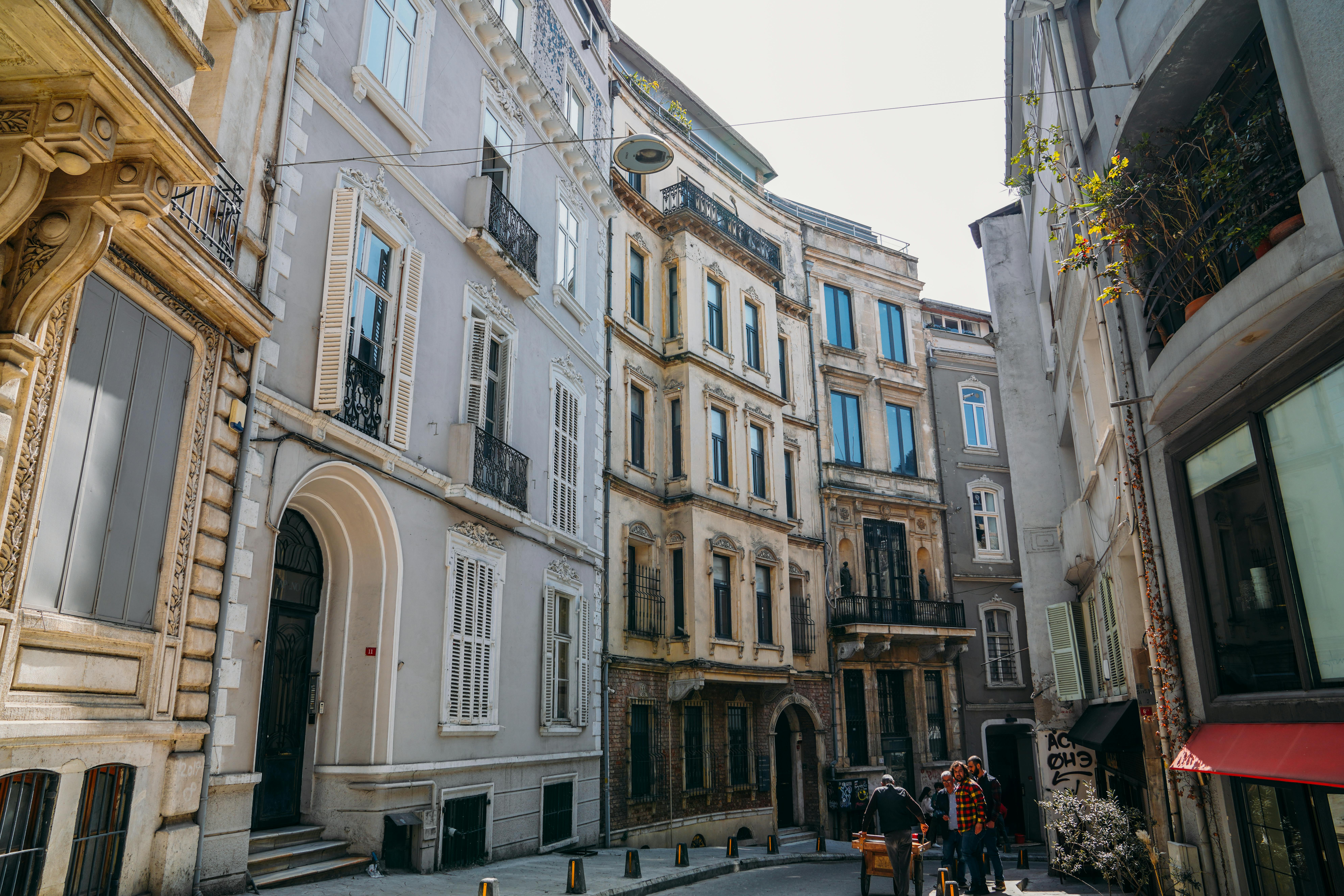 A Street in Between Concrete Buildings · Free Stock Photo