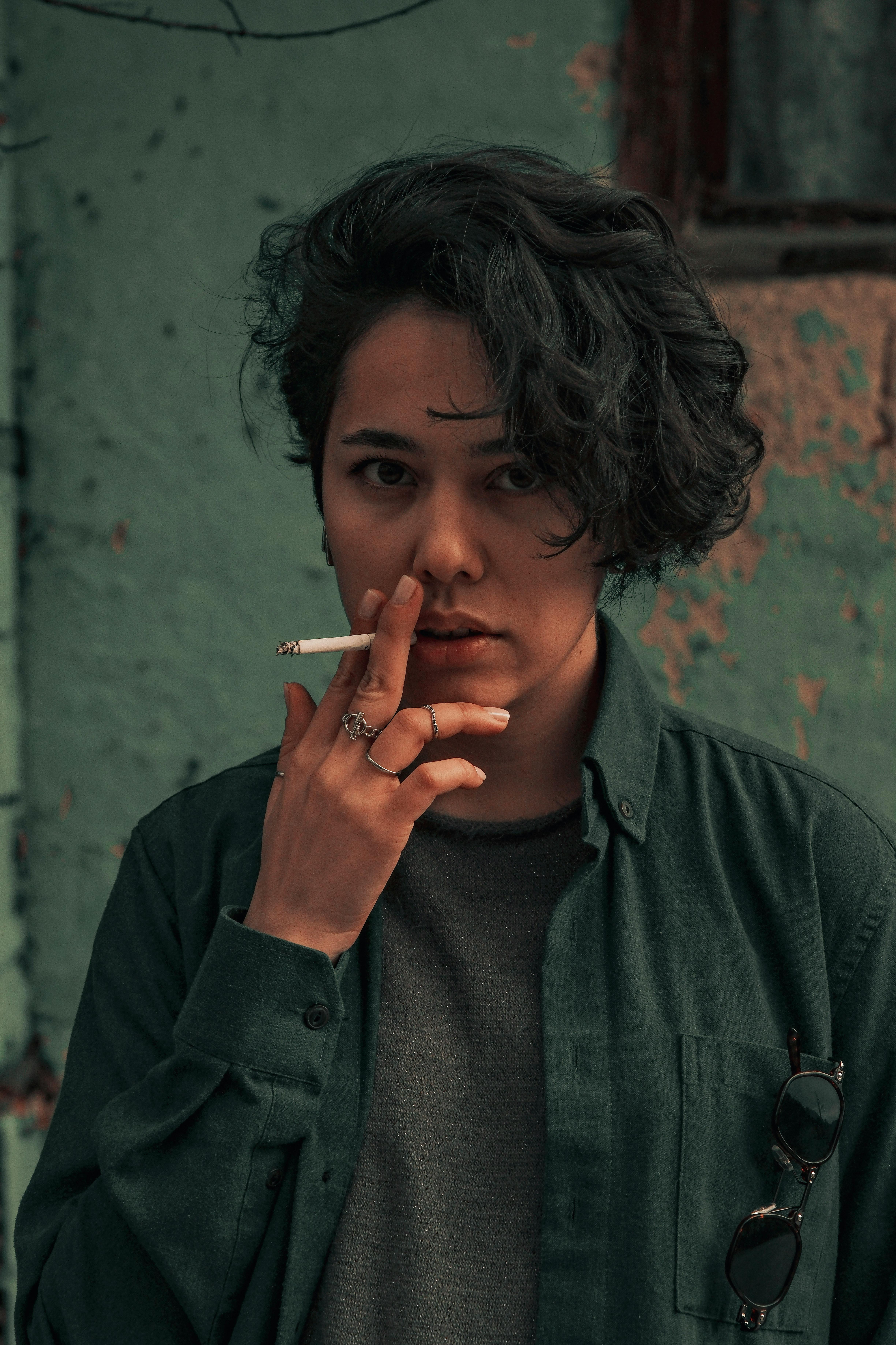 A Curly Hair Woman Smoking Weed · Free Stock Photo