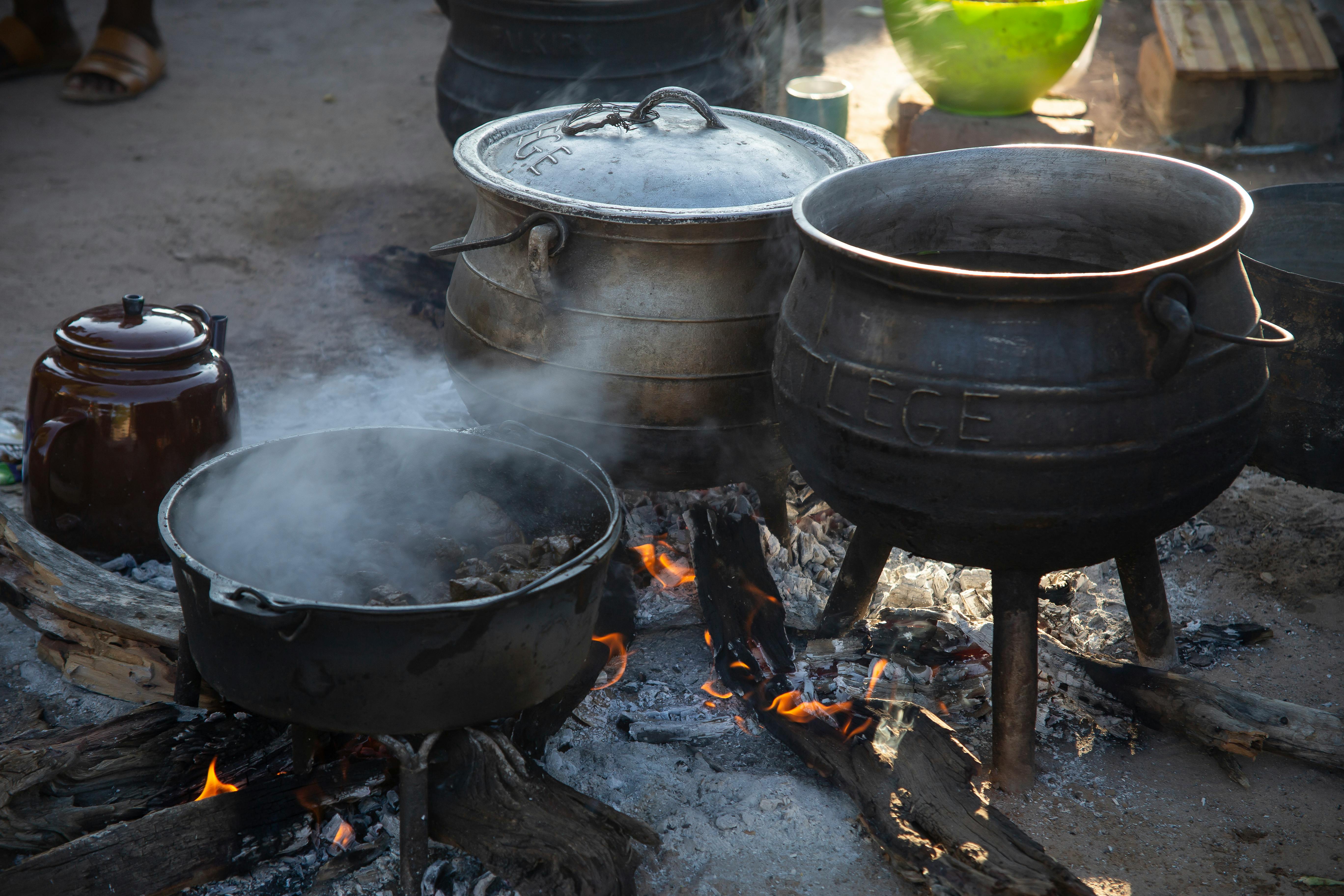 Three-legged Cast Iron Pots on Fire · Free Stock Photo