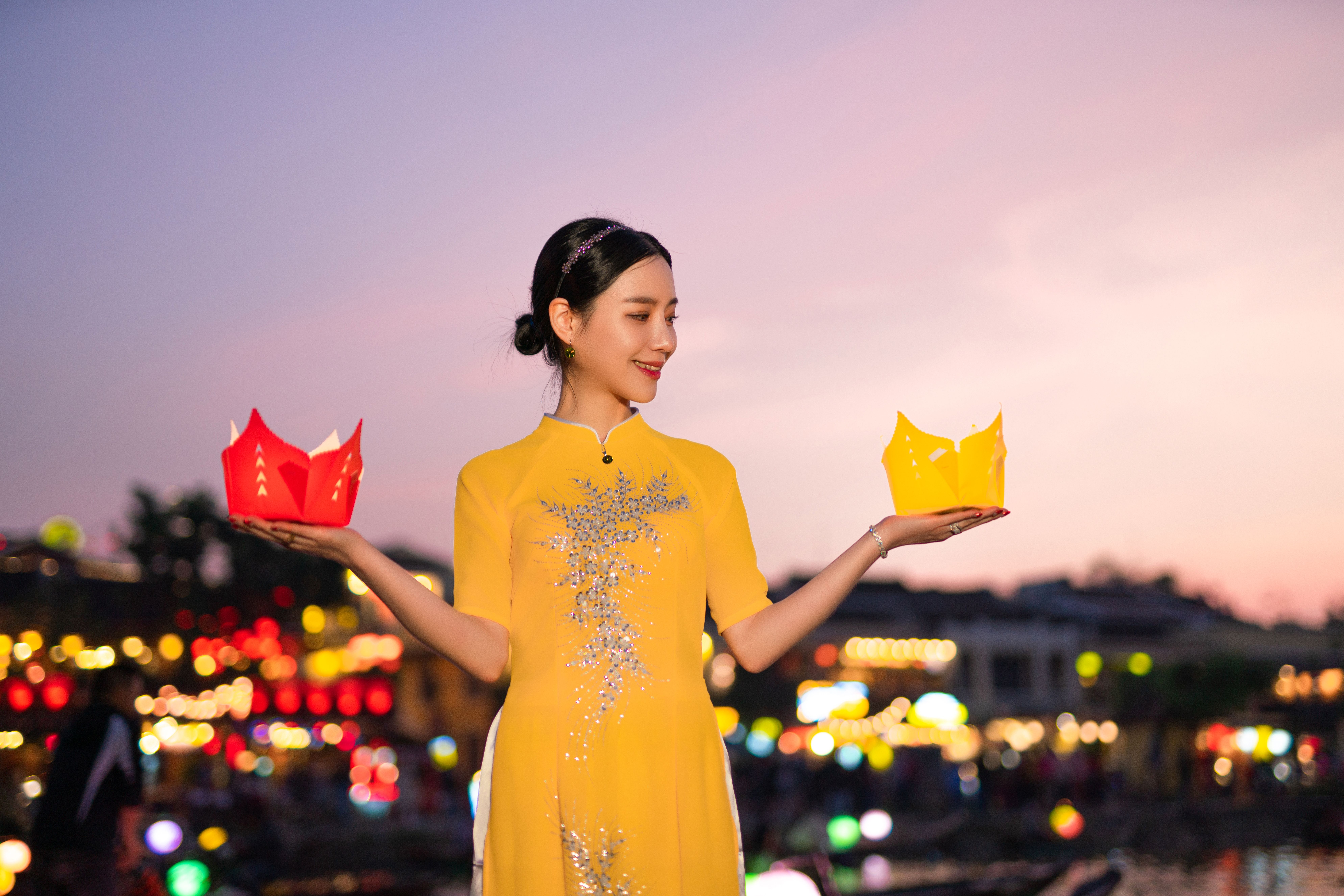 Woman Wearing Traditional Dress and Holding Crowns · Free Stock Photo