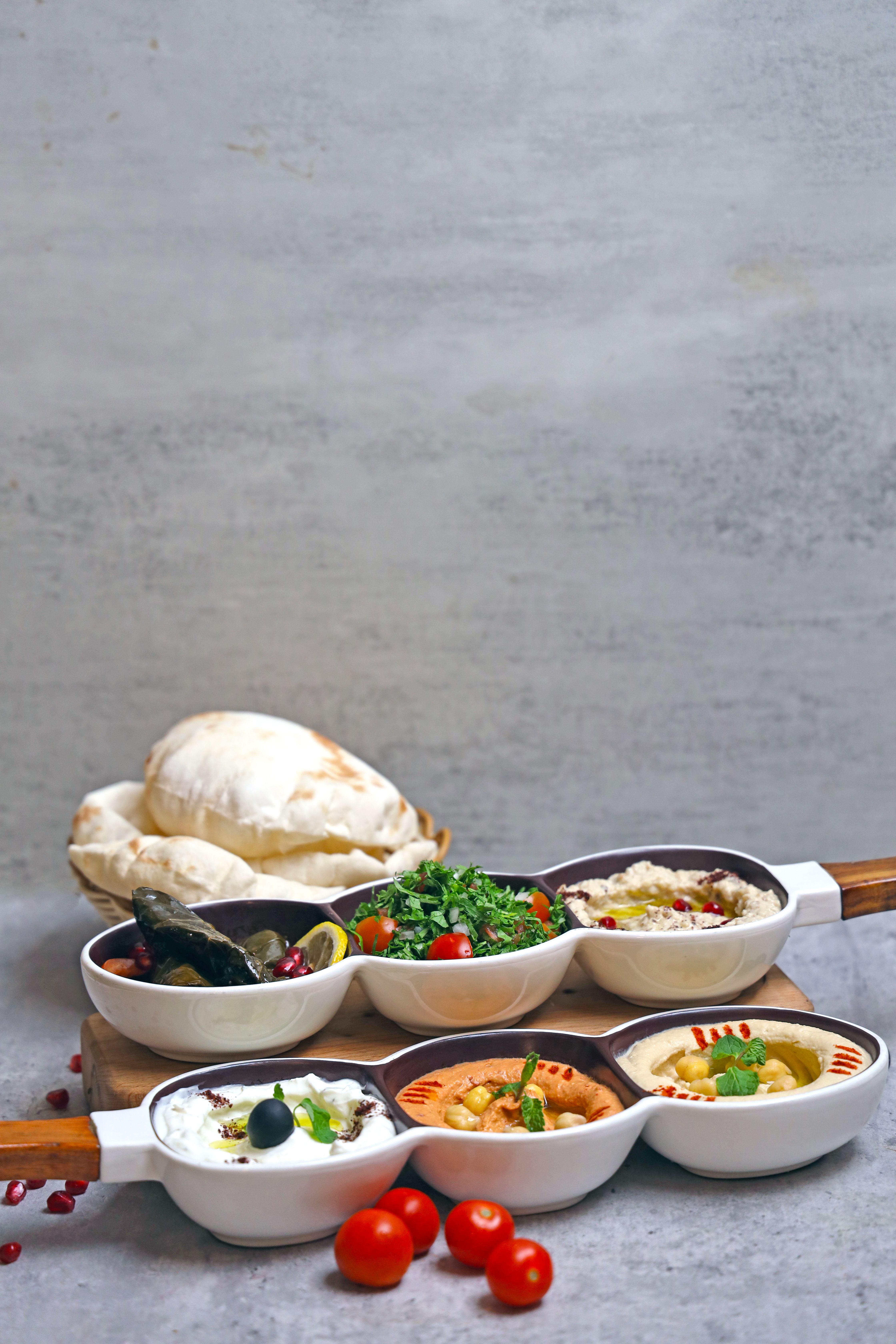 A set of dishes with food on them · Free Stock Photo
