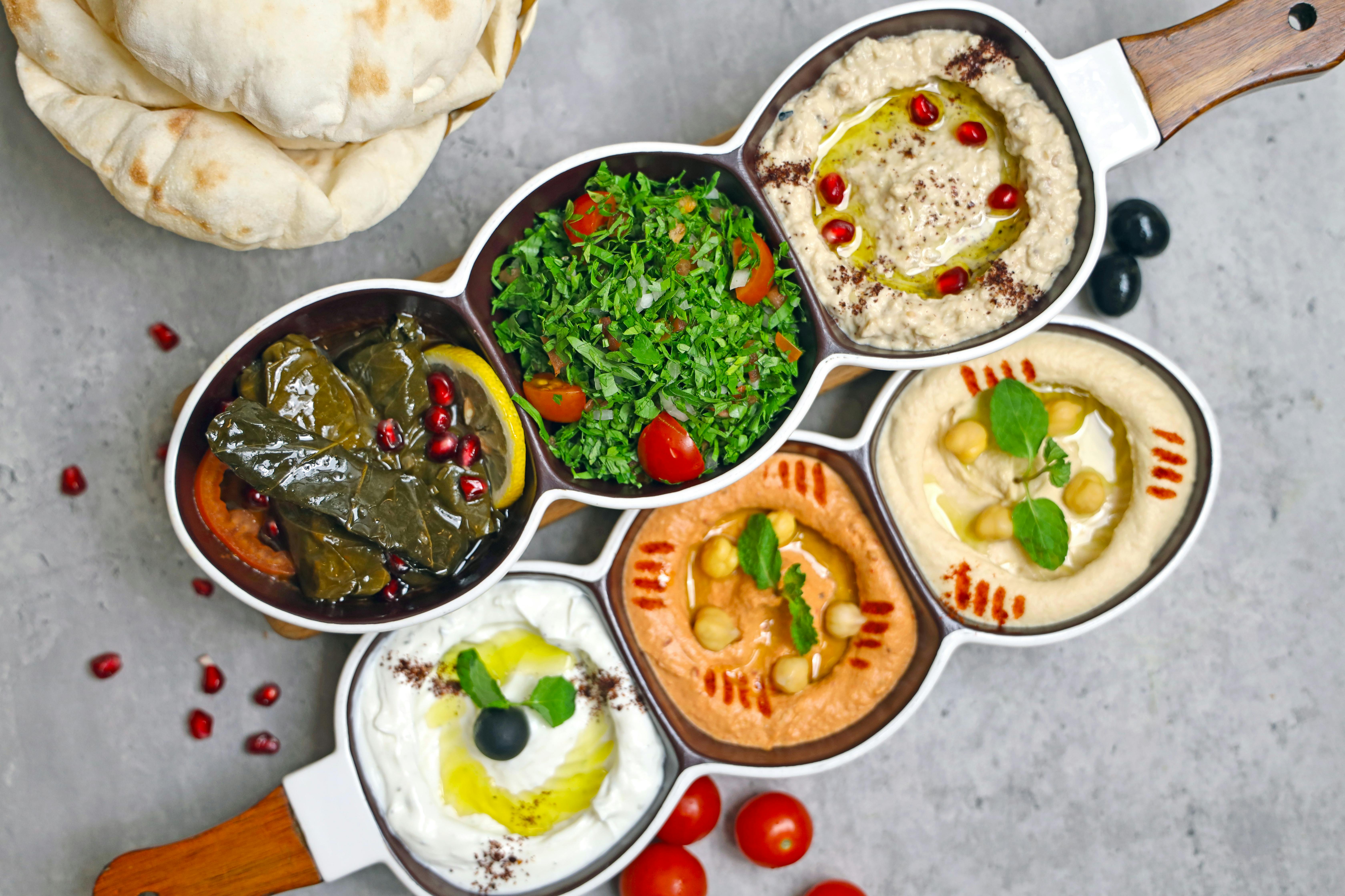 A set of four bowls with different types of food · Free Stock Photo