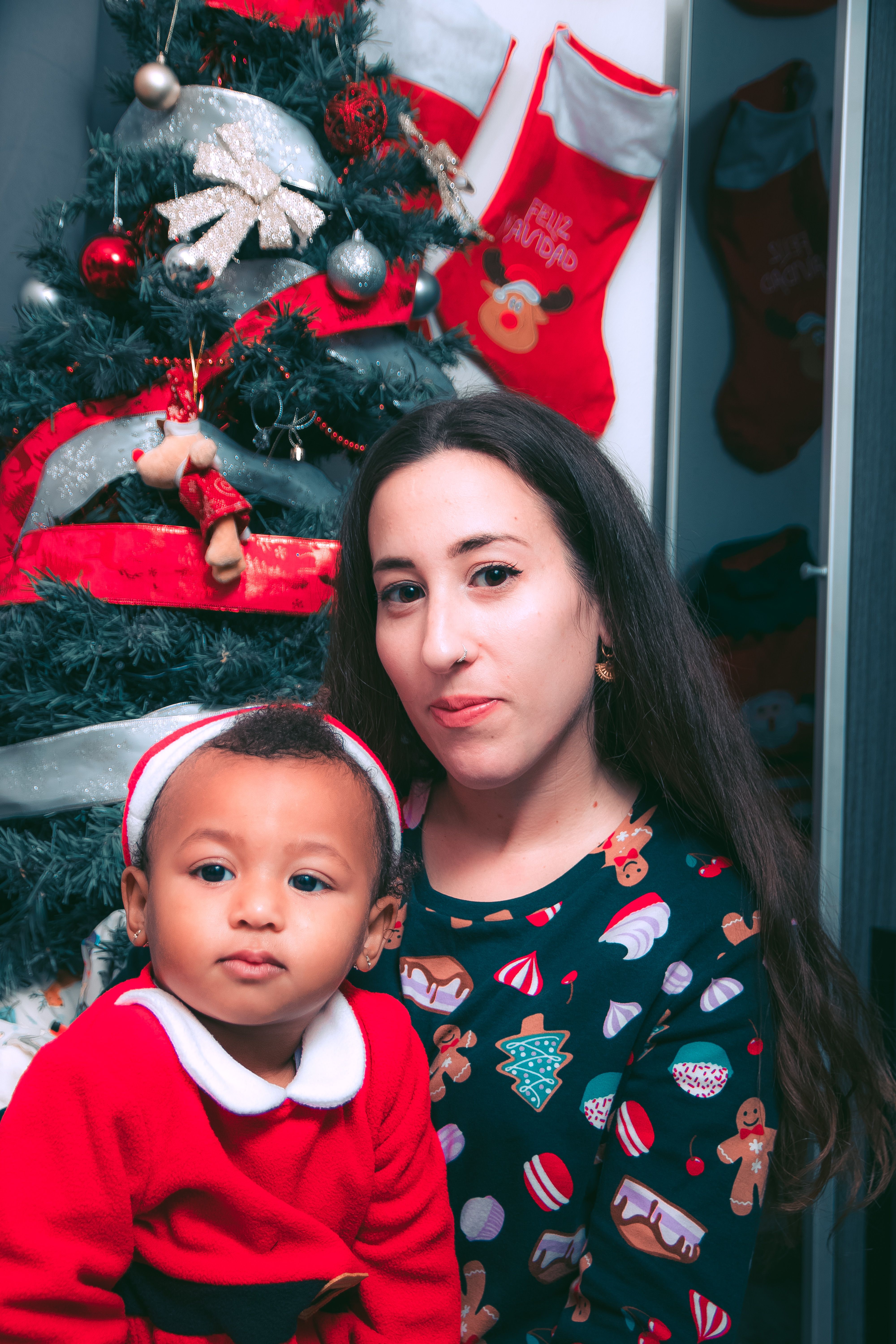 Woman and Children Sitting by a Christmas Tree · Free Stock Photo