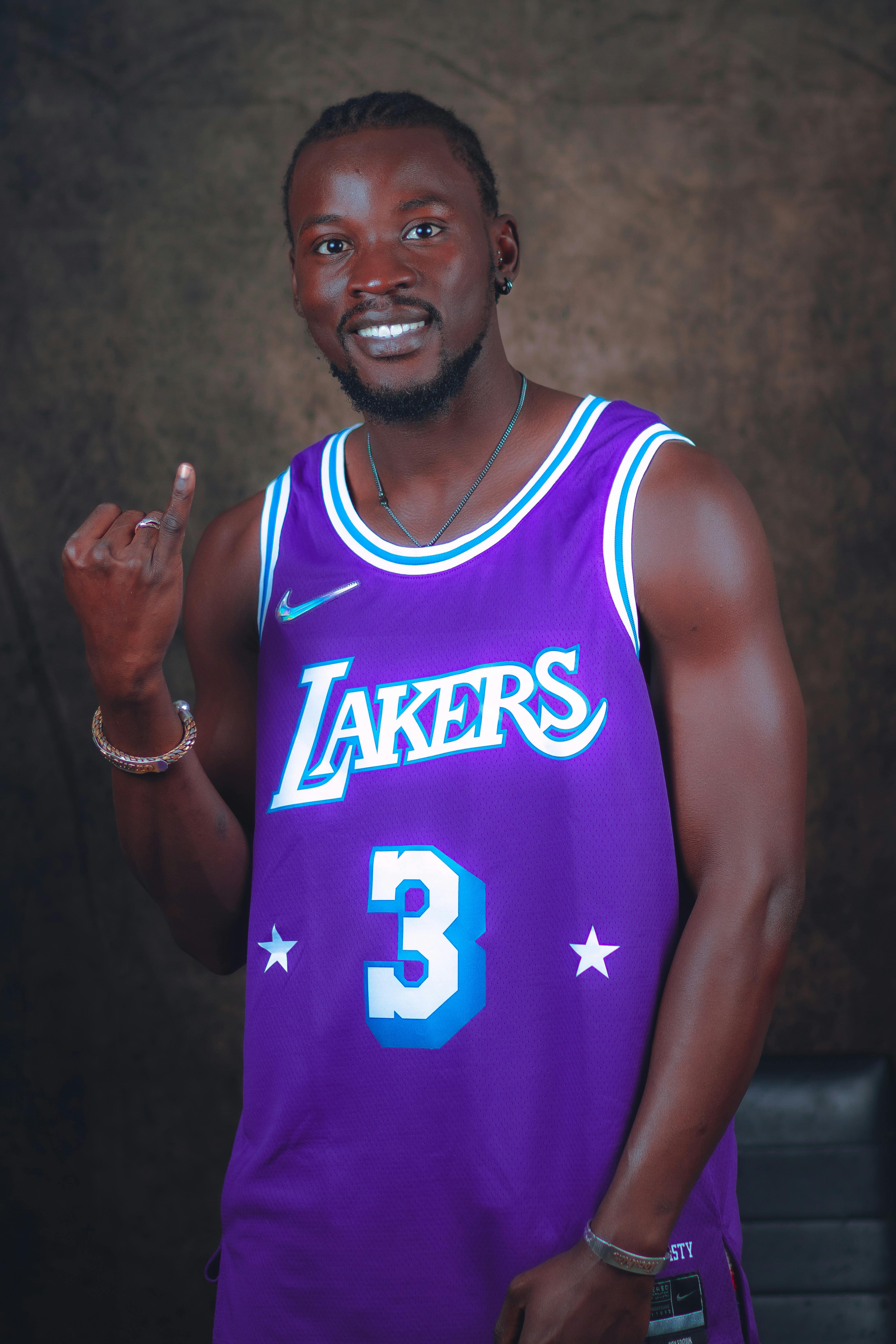 A Basketball Player Kissing a Medal · Free Stock Photo