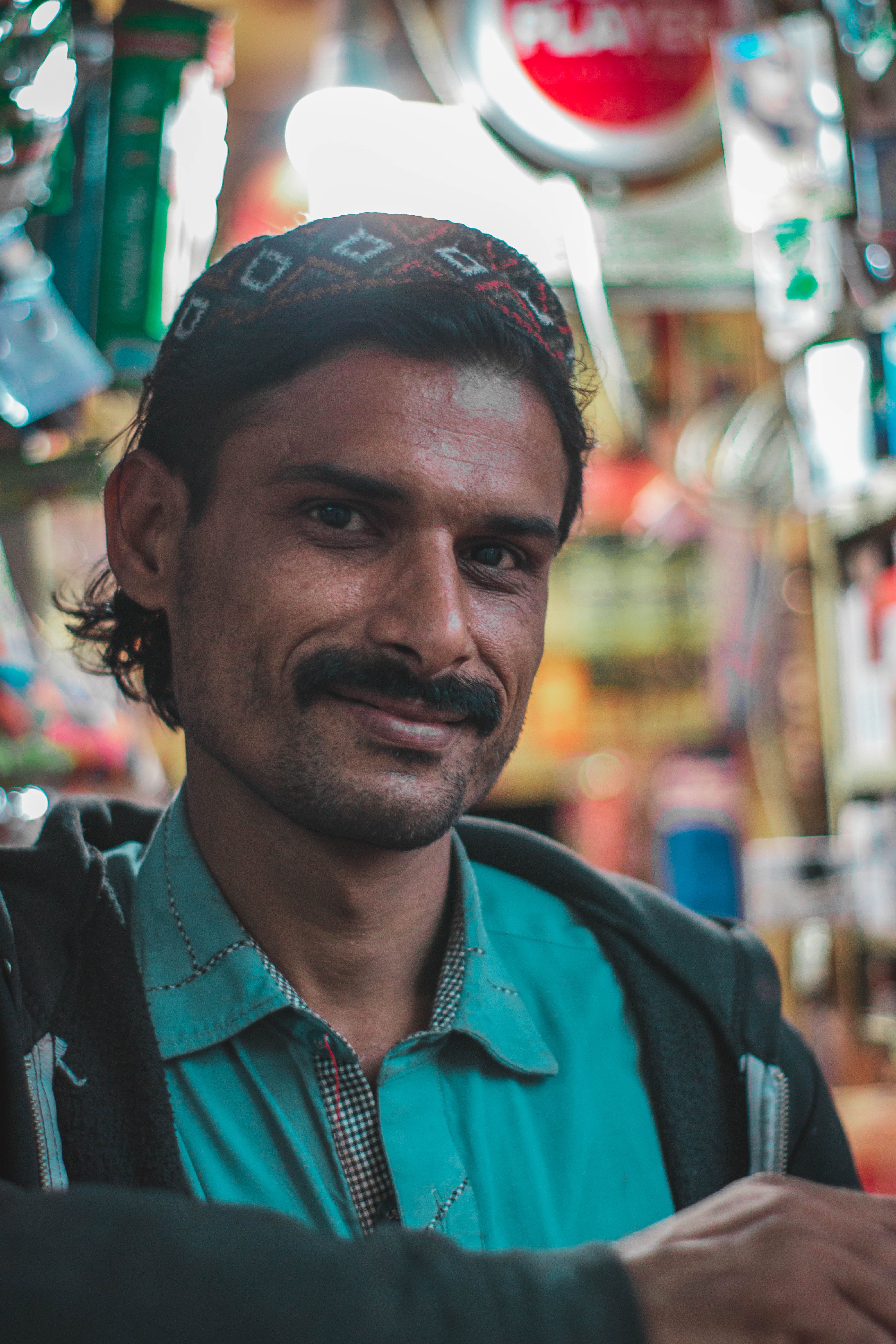 Portrait of Man with Moustache in Traditional Headwear · Free Stock Photo