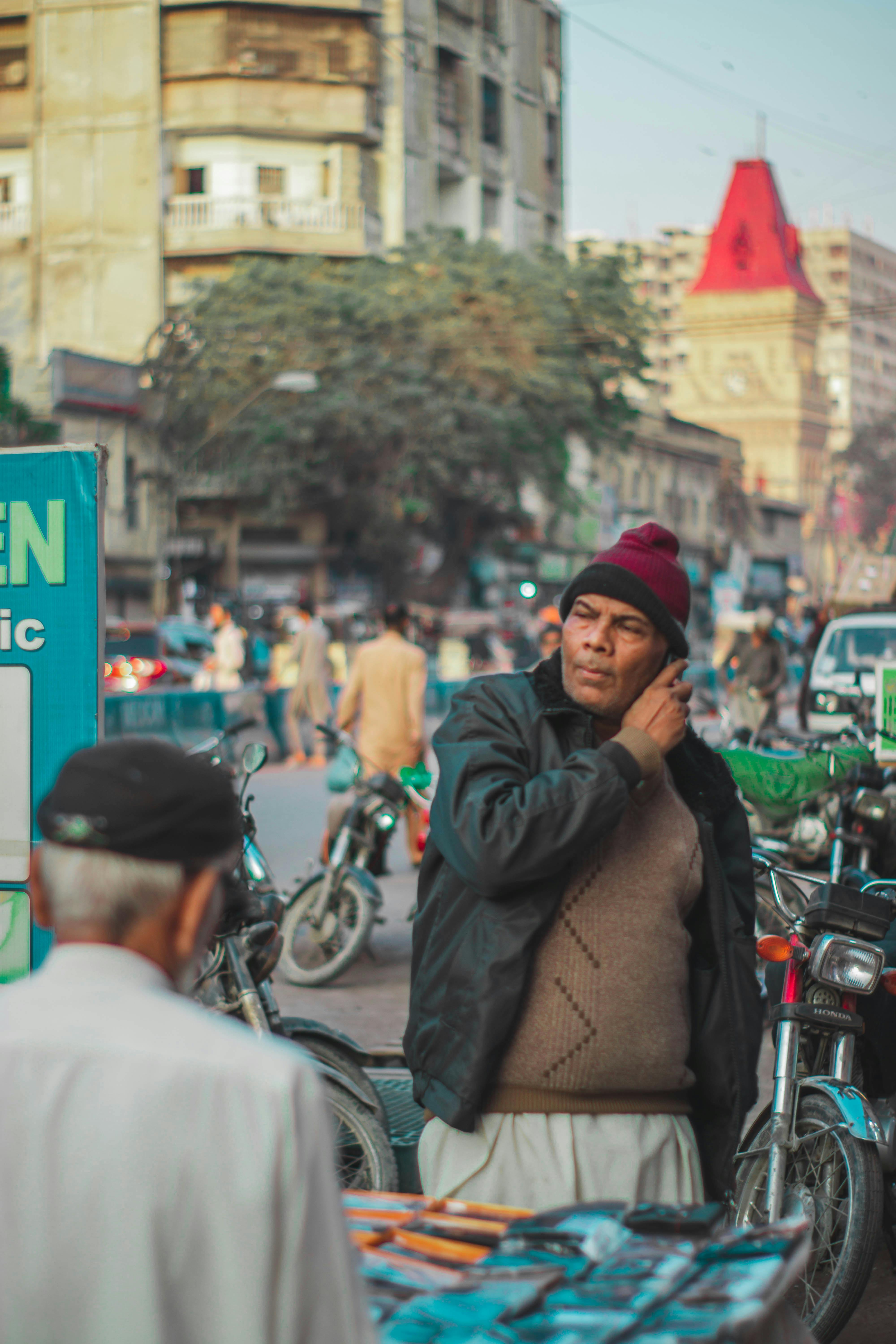 Man Selling on City Street · Free Stock Photo