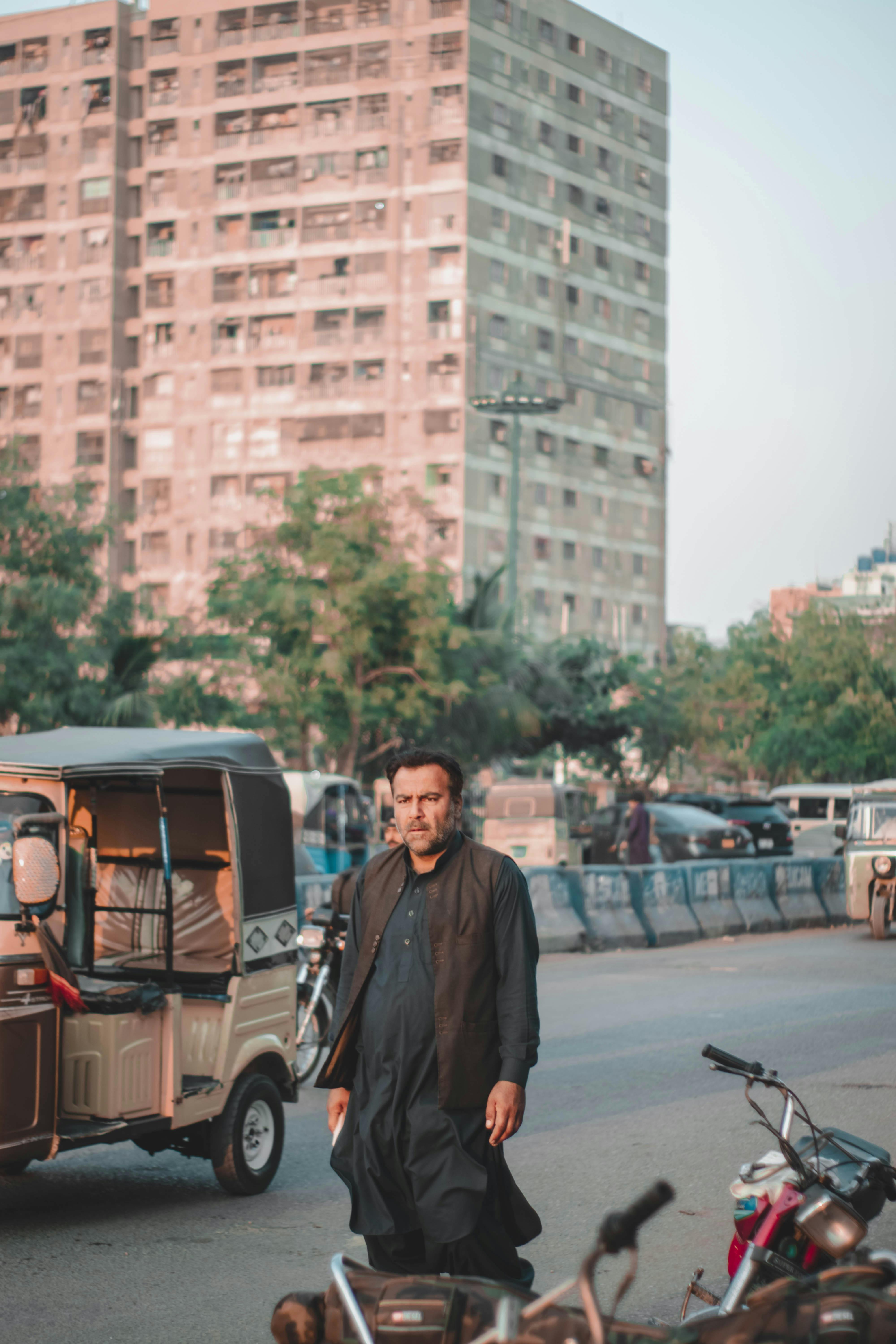 Homeless Man with Bag Walking on Street · Free Stock Photo