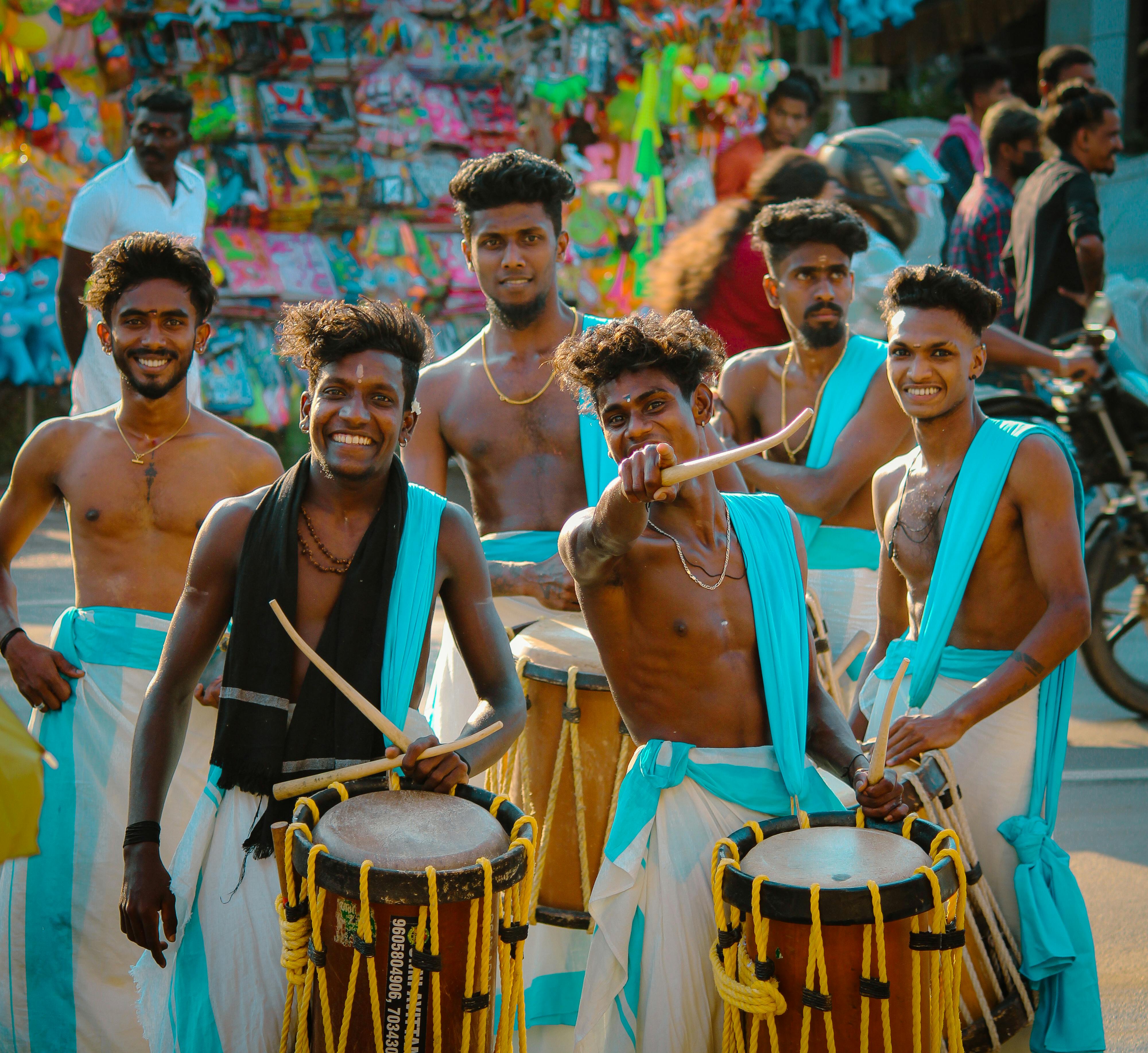 Group of Men Standing on a Street with Drums · Free Stock Photo