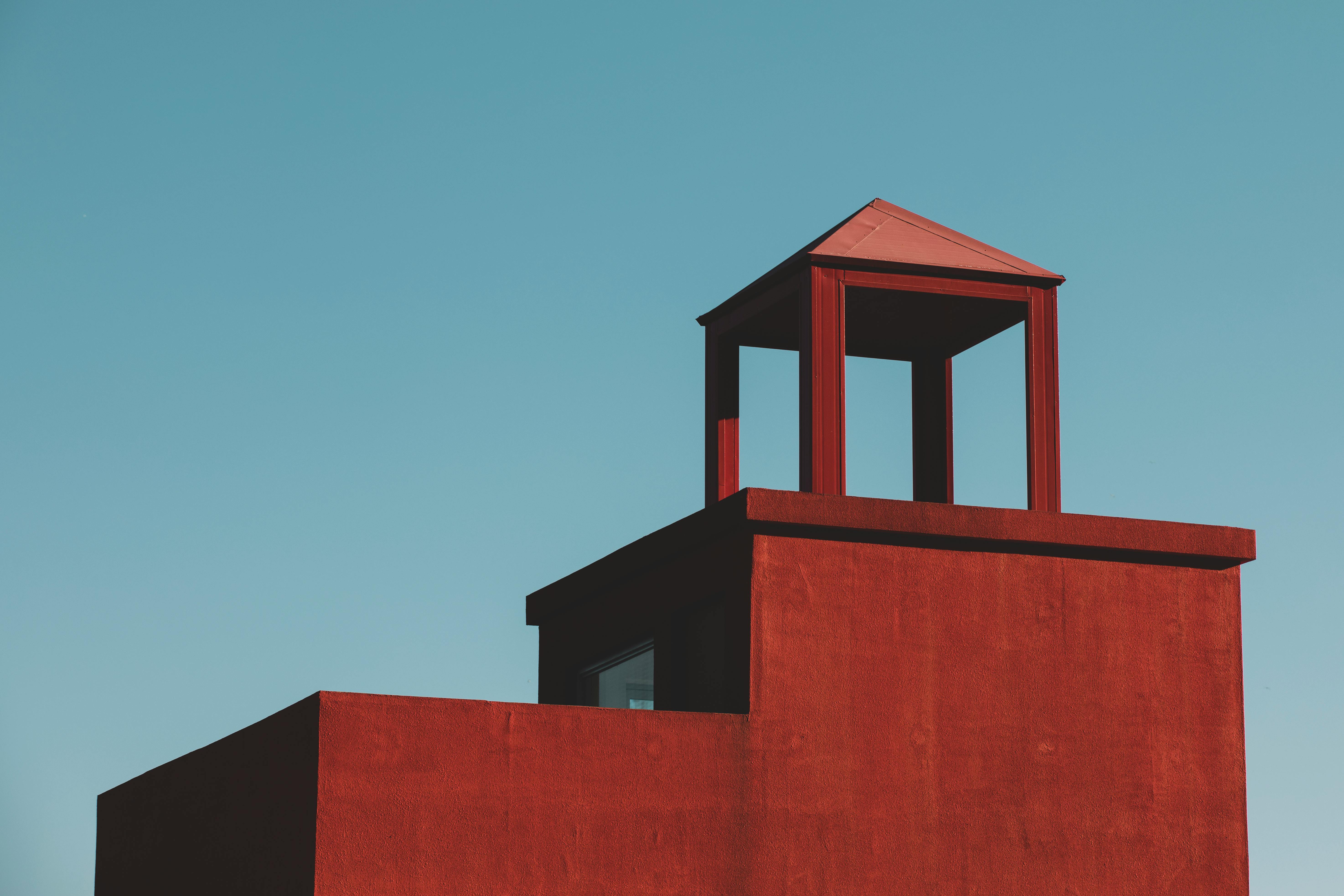 Clear Sky over Red Building Wall · Free Stock Photo