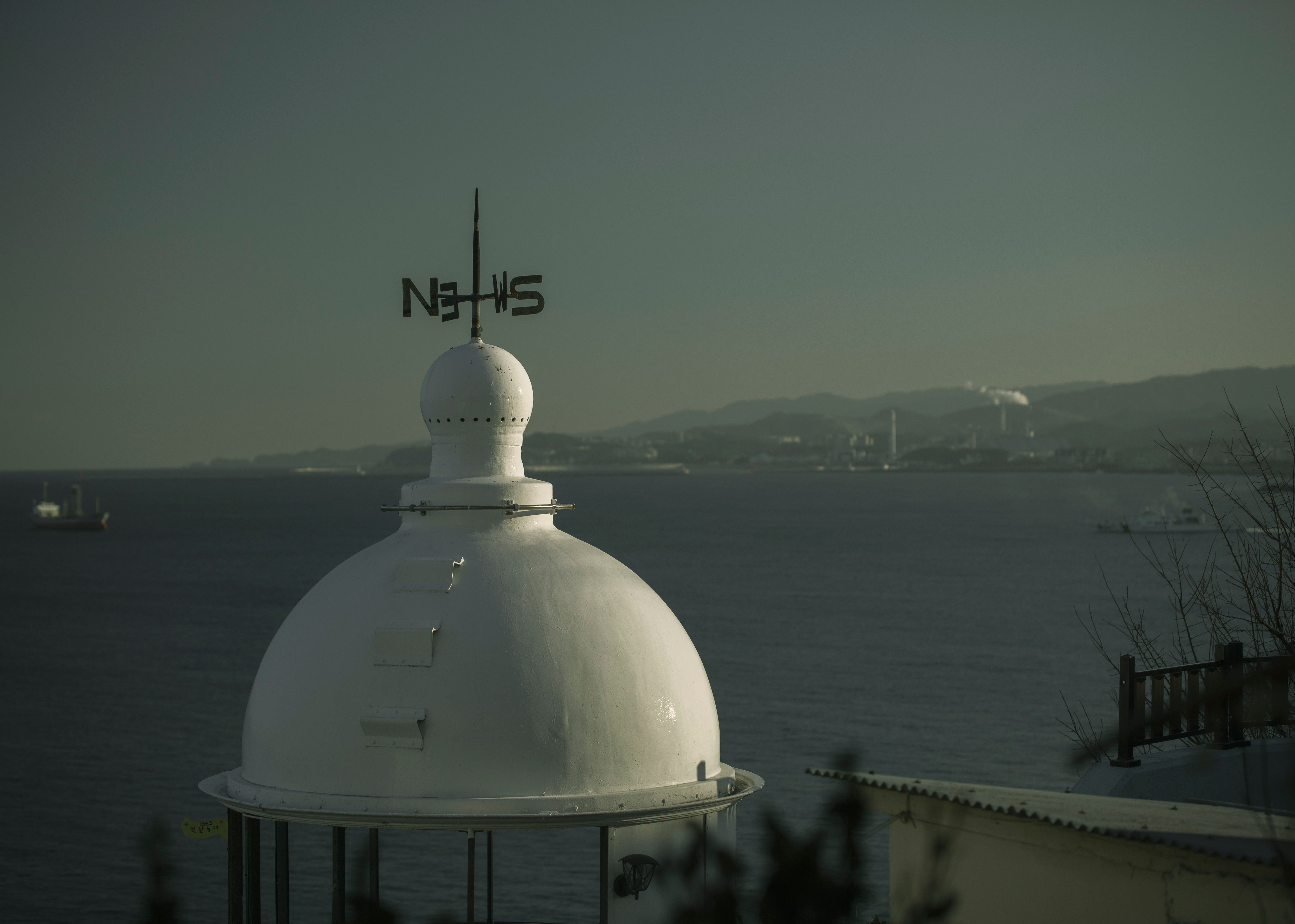 Wind Vane on Top of a Dome Roof · Free Stock Photo