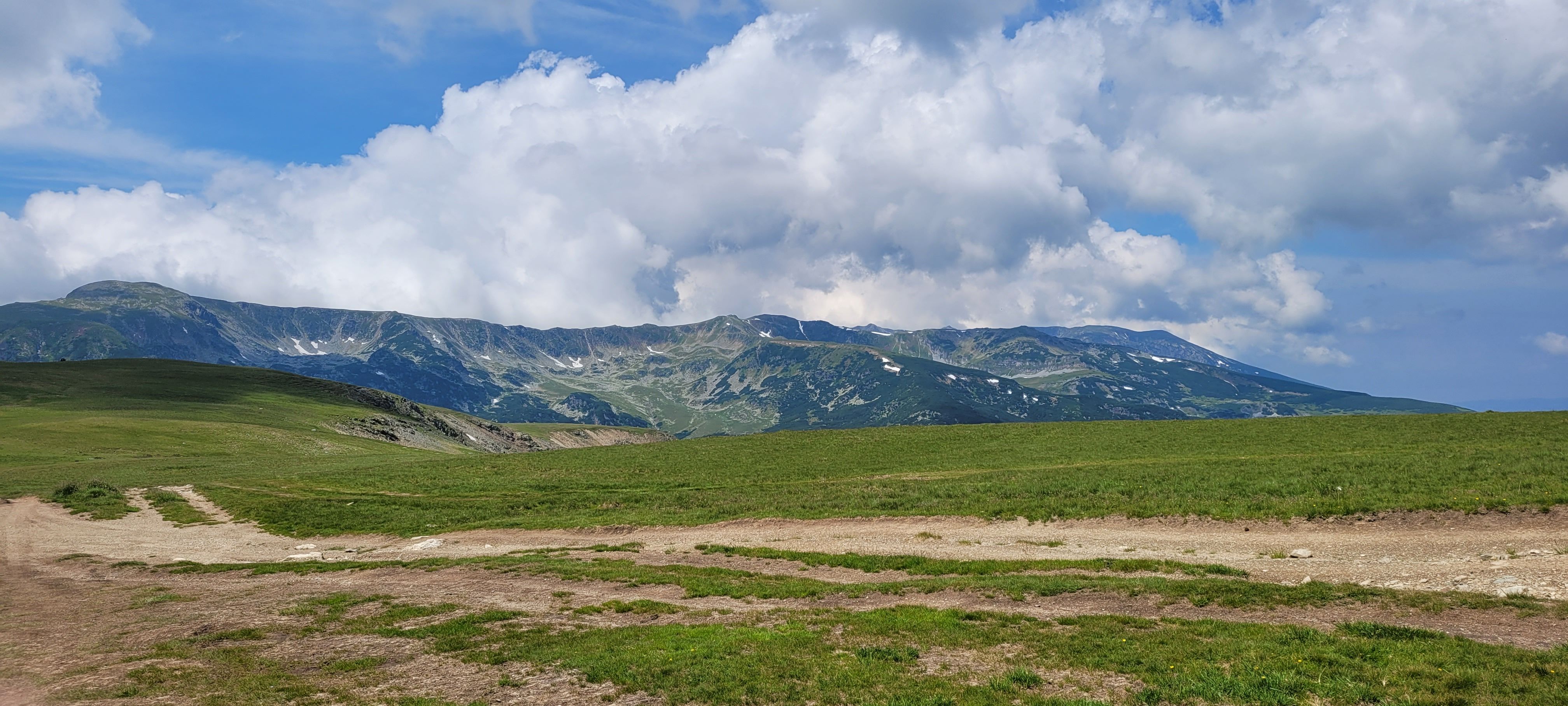 Clouds over Plains and Hills behind · Free Stock Photo