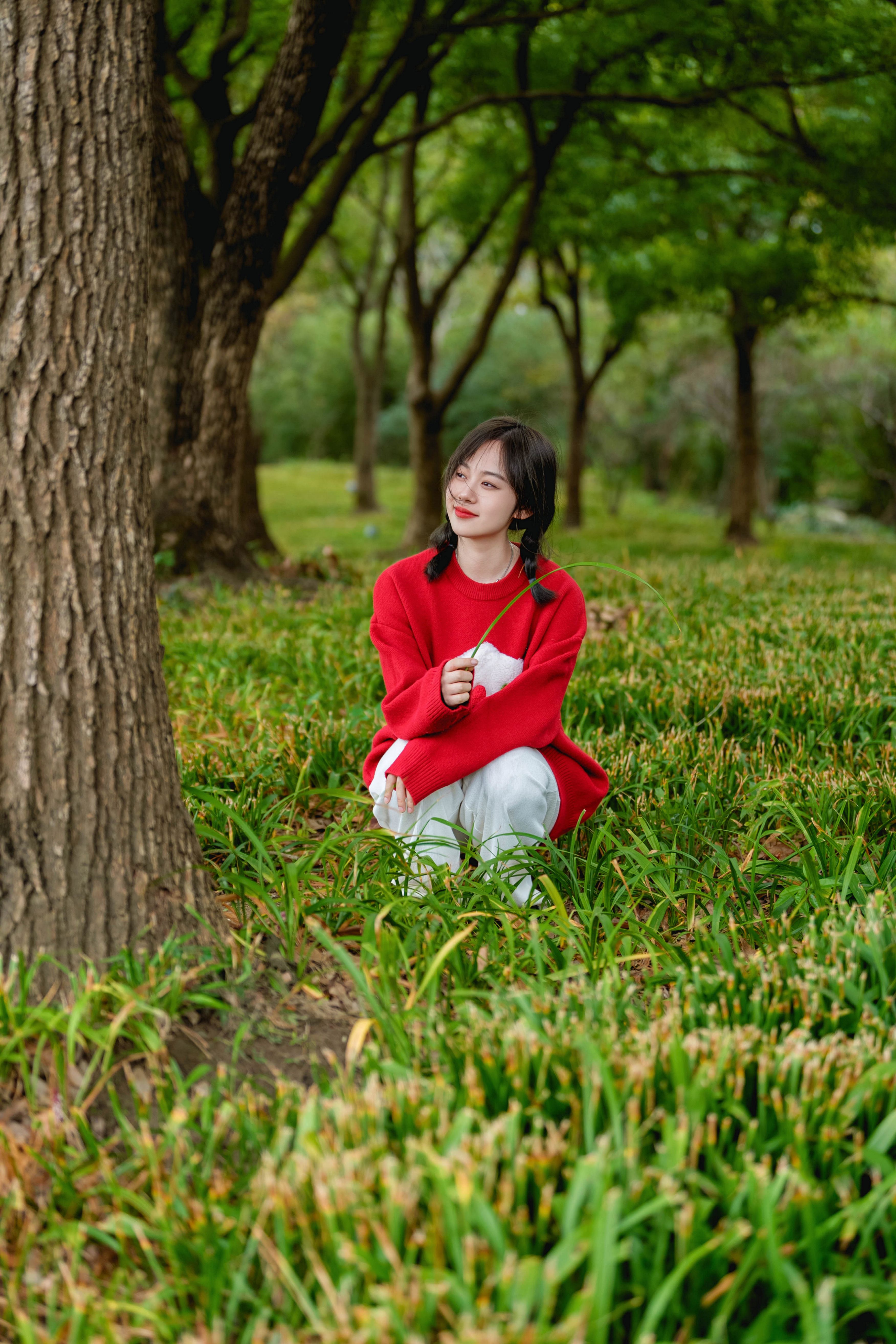Crouching on Dried Grass Woman Smoking Cigarette · Free Stock Photo