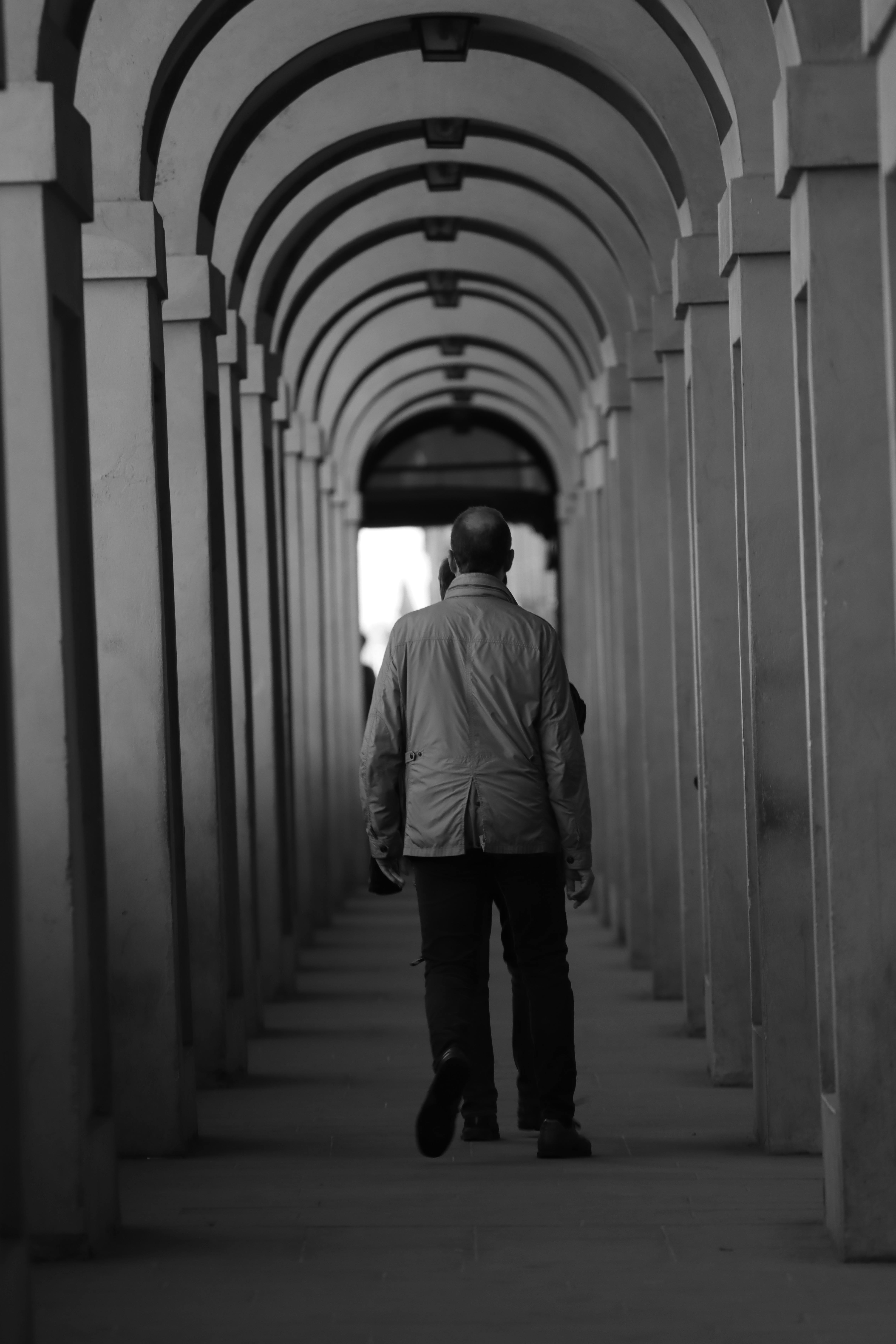 Man Walking on the Hallway · Free Stock Photo