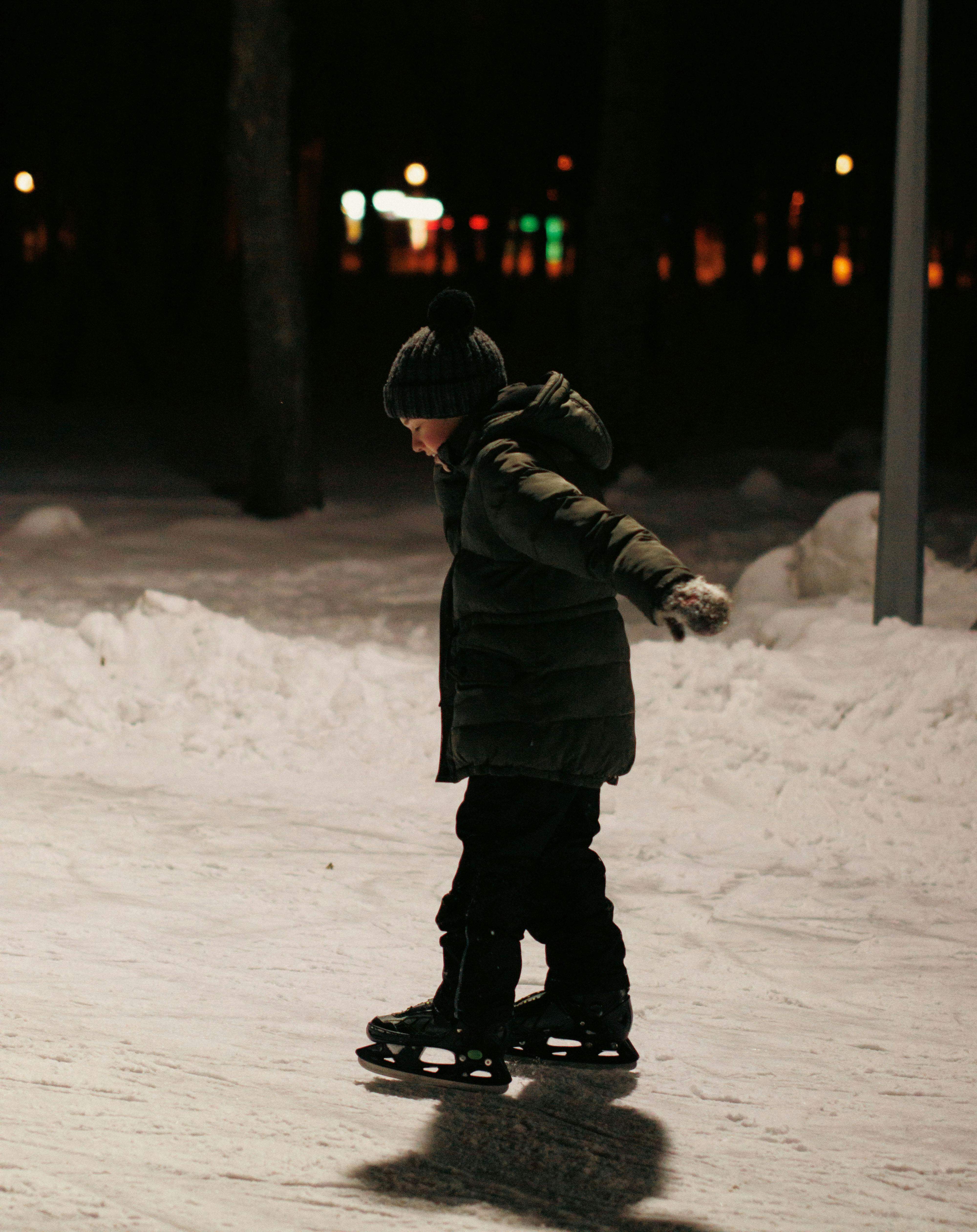 A Boy Ice Skating at Night · Free Stock Photo