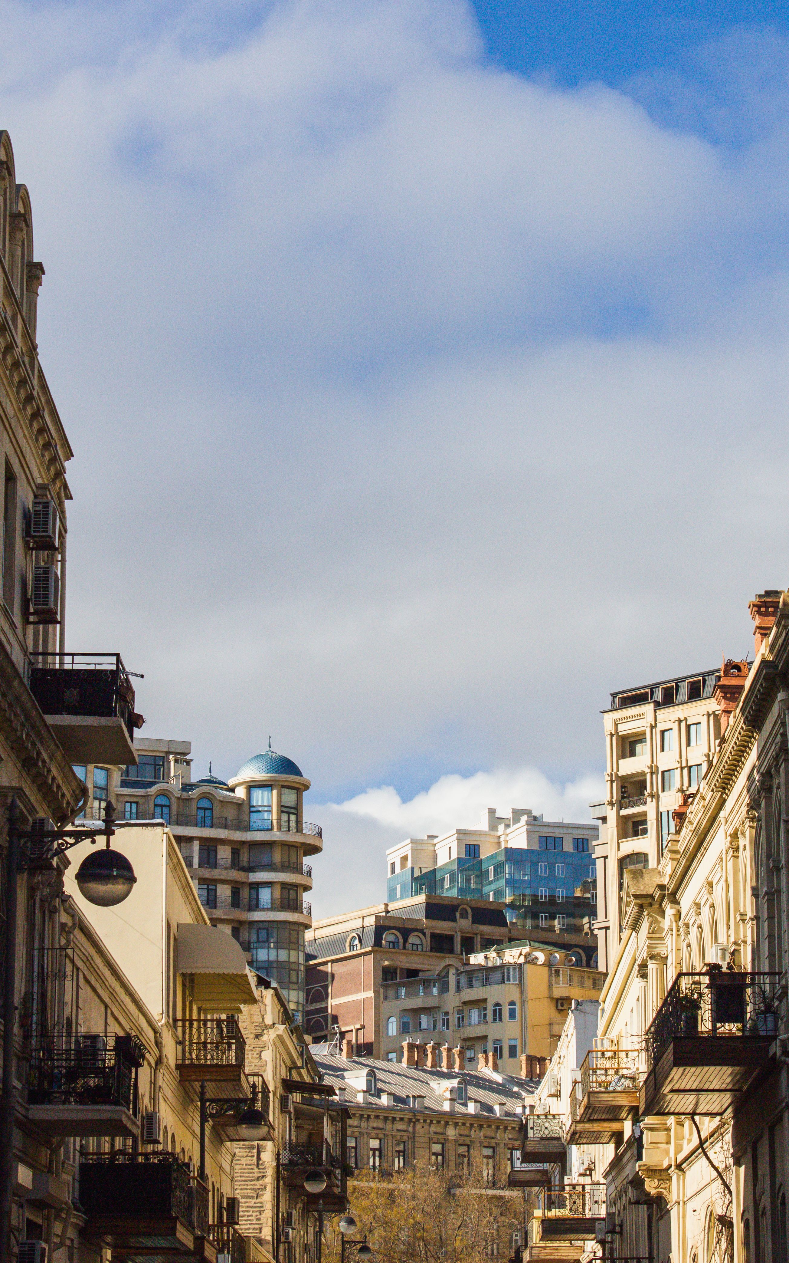 Residential and Historical Buildings on a Hill in a Town · Free Stock Photo