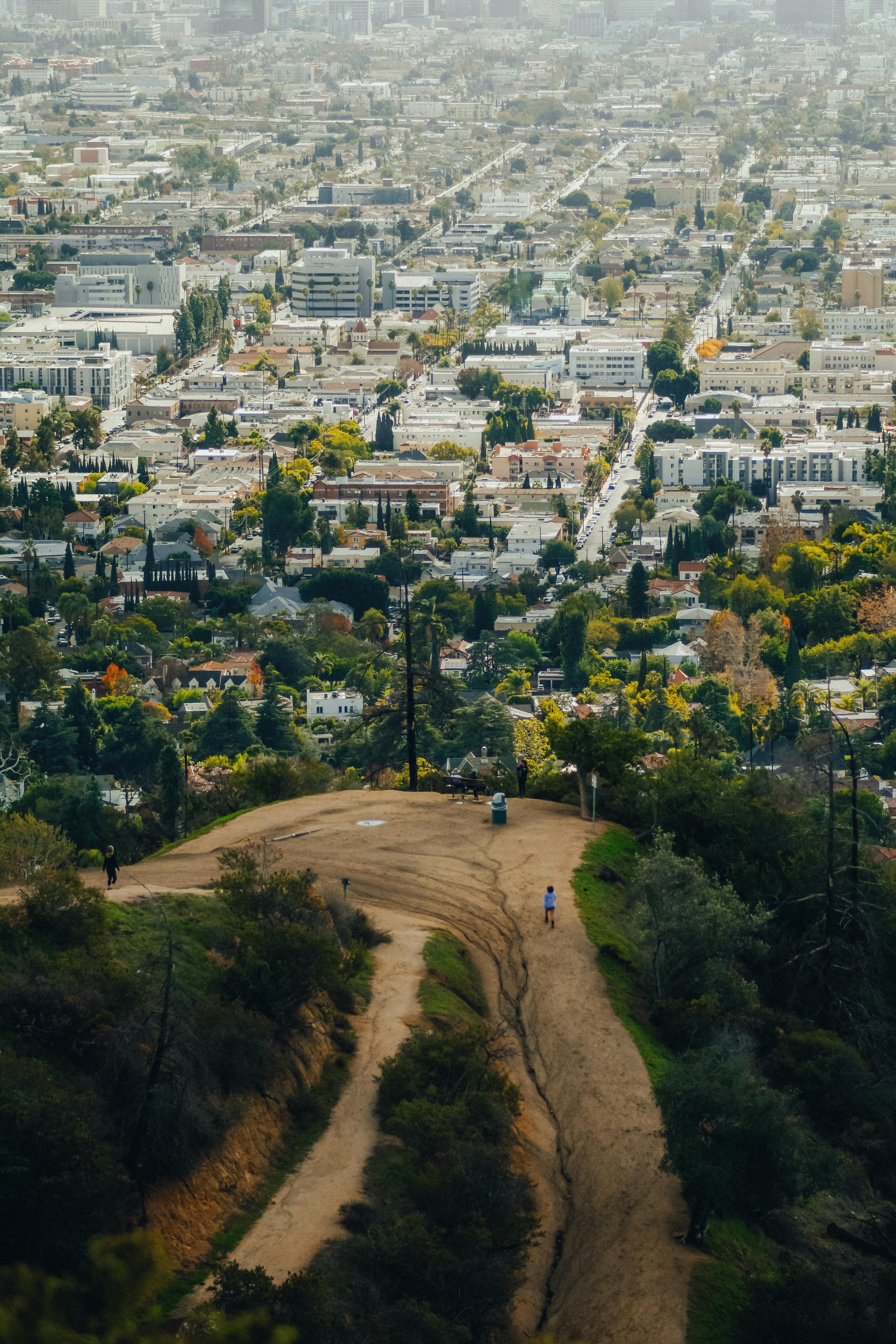 Aerial View of a Hill with a Hiking Trail and View of the City of Los ...