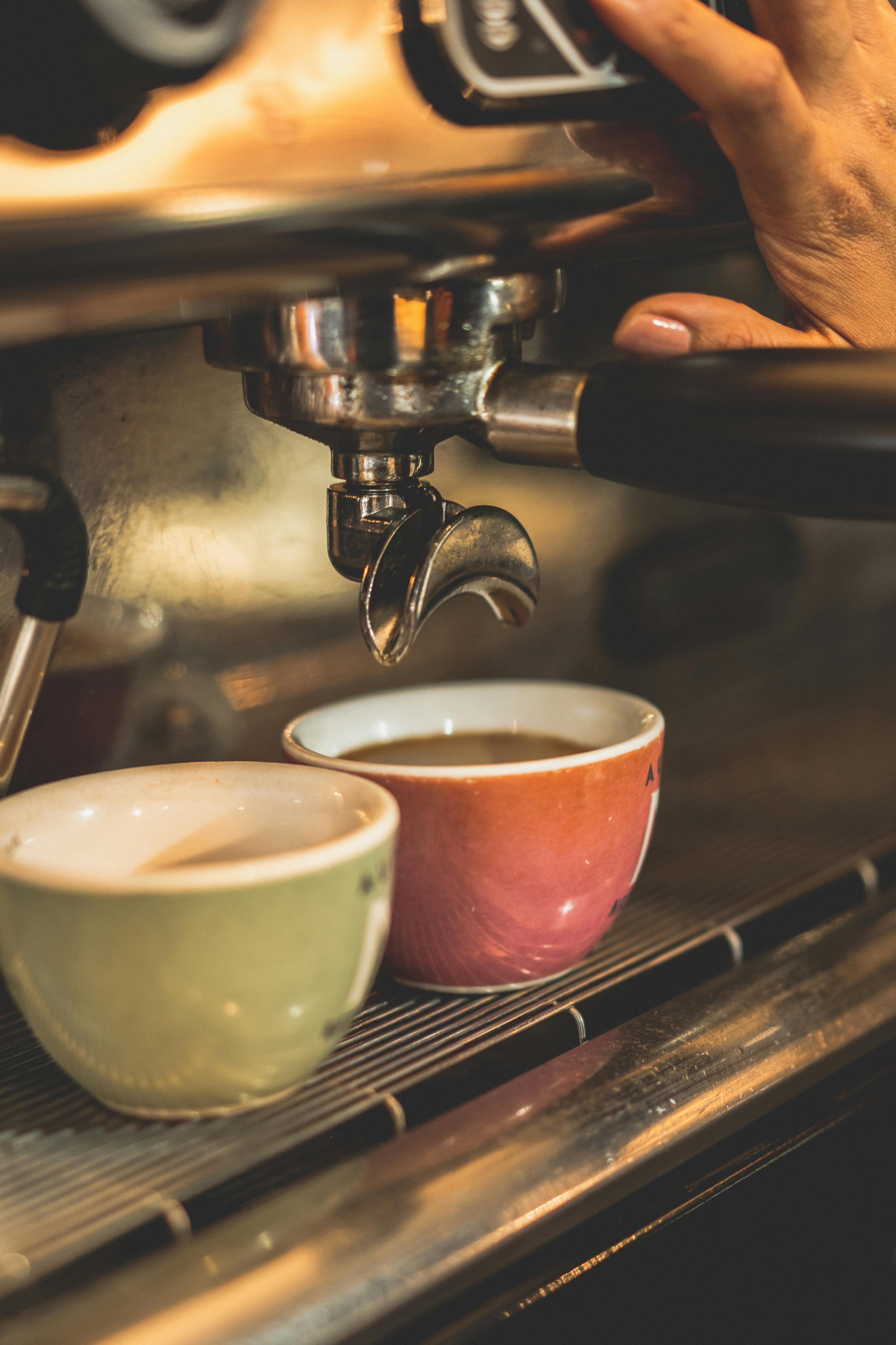 A Person Using a Coffeemaker · Free Stock Photo