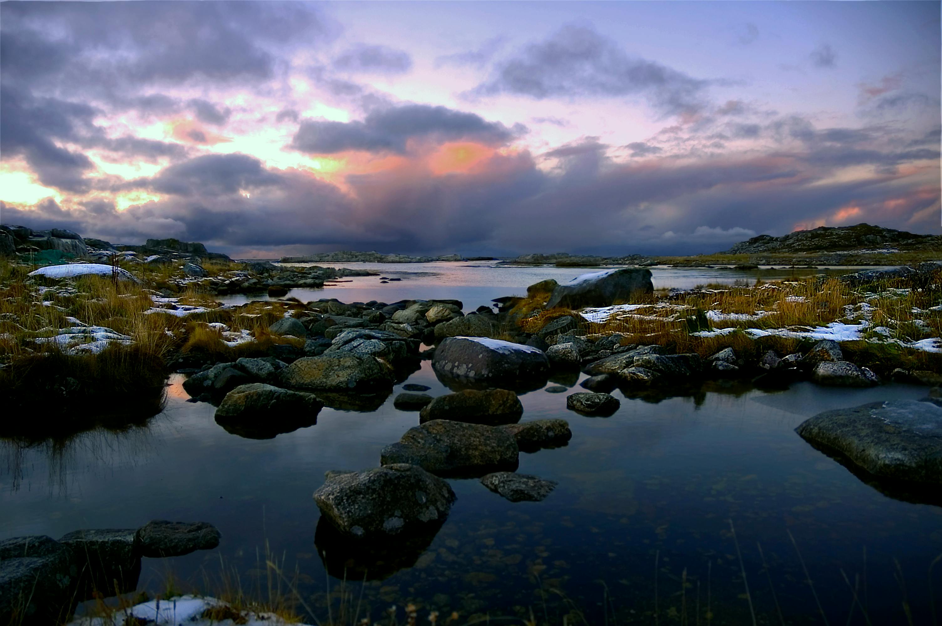 Rocks on Body of Water · Free Stock Photo