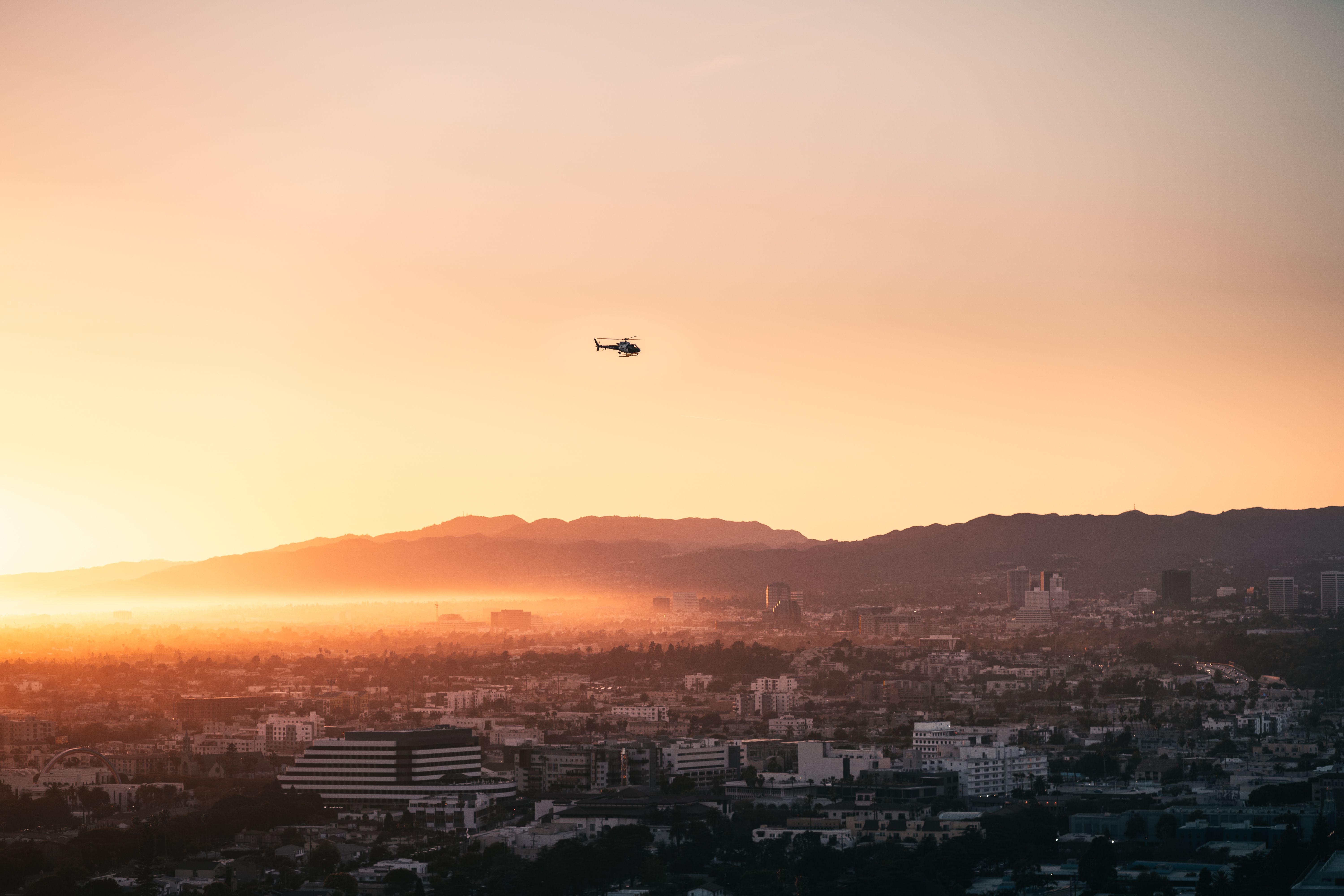 Helicopter over City at Dawn · Free Stock Photo