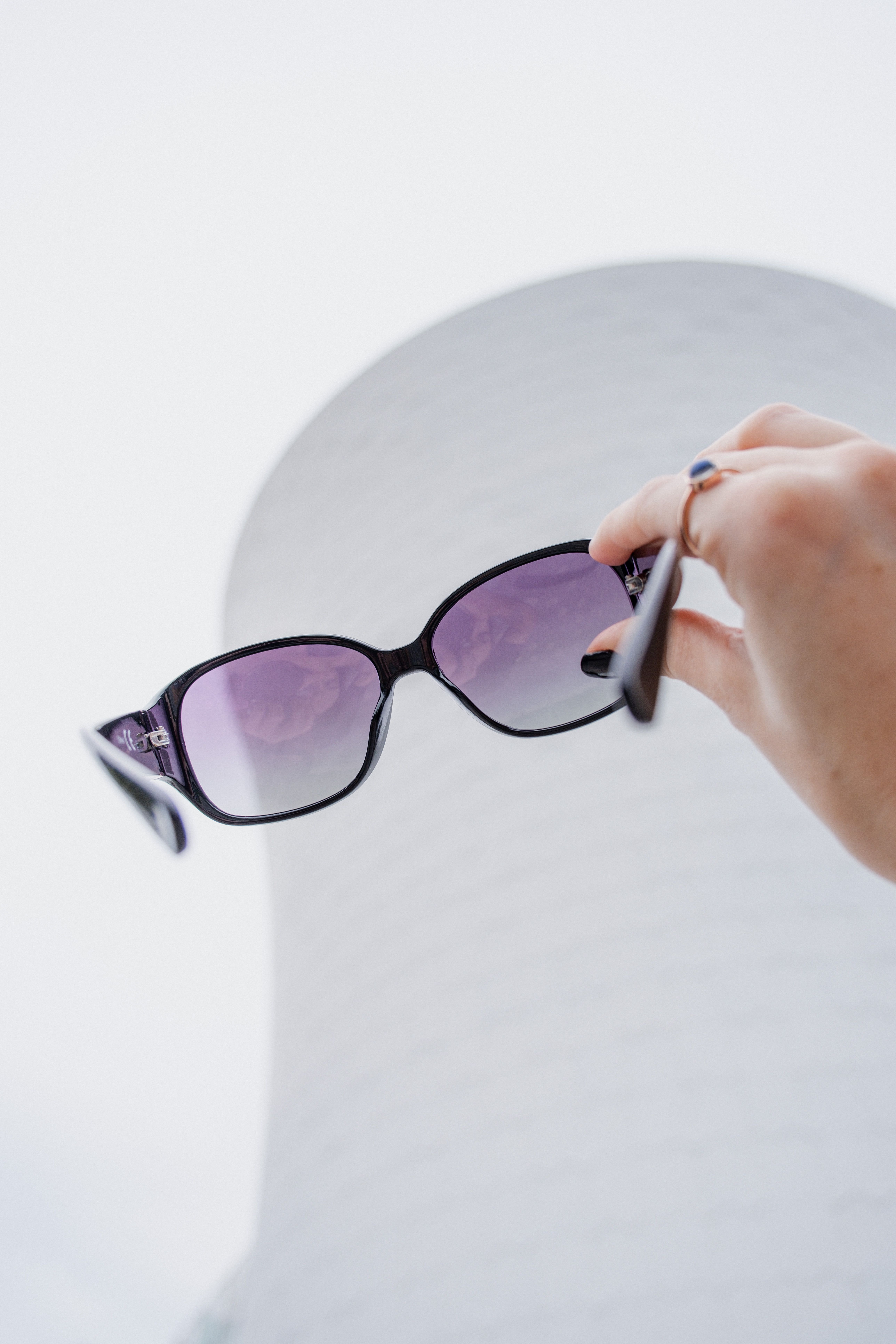 Woman Holding Sunglasses over a Shadow · Free Stock Photo