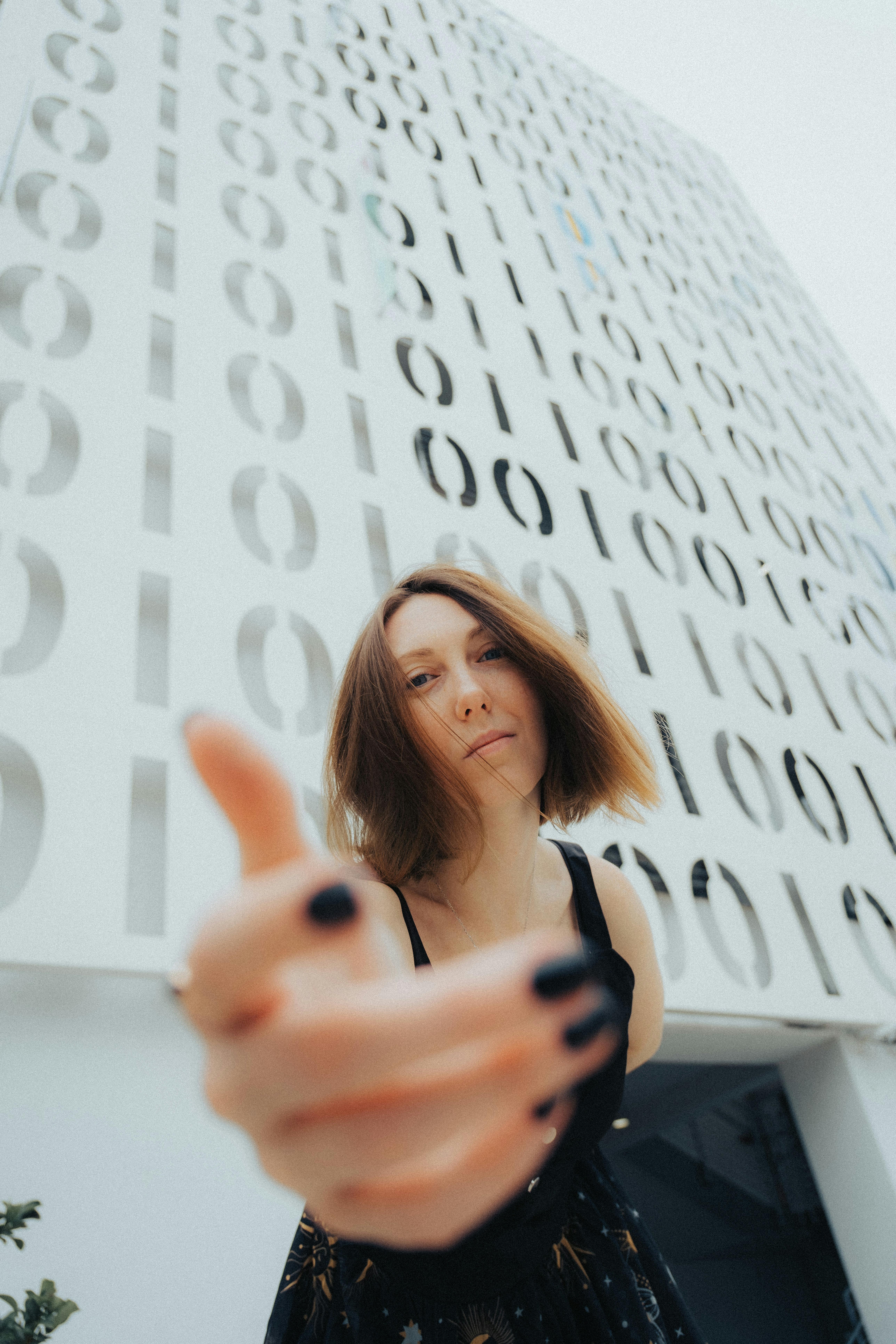 Woman Leaning Forward and Reaching Out · Free Stock Photo