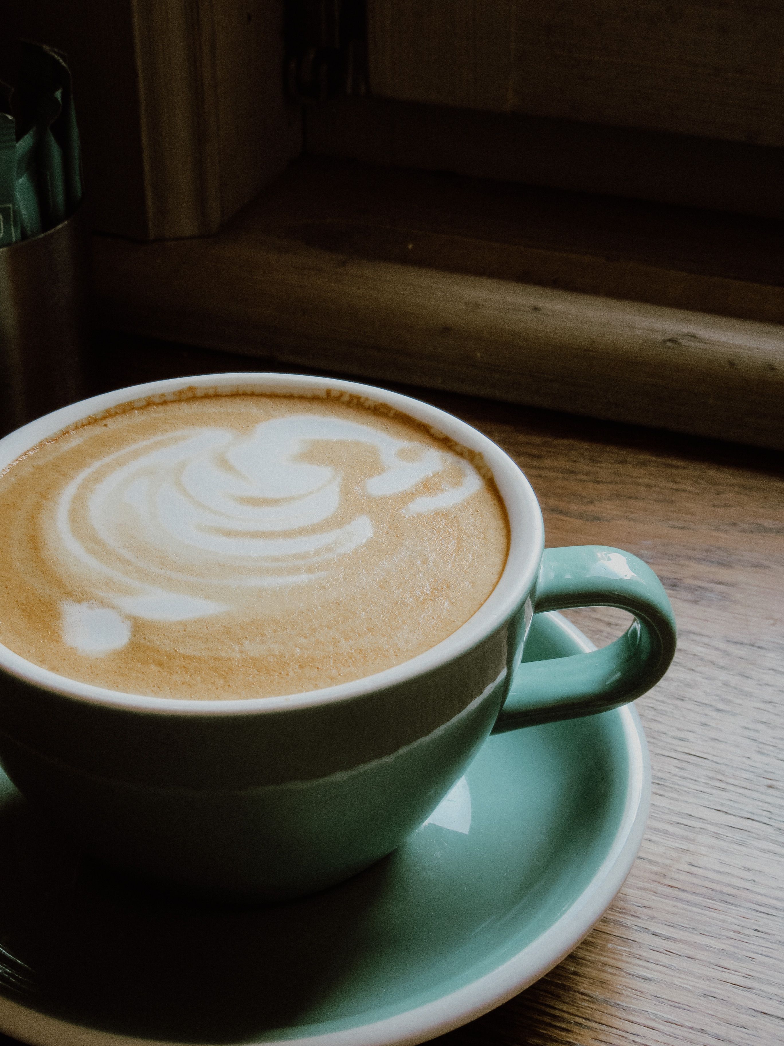 Close Up Shot of Green Cup with Coffee · Free Stock Photo