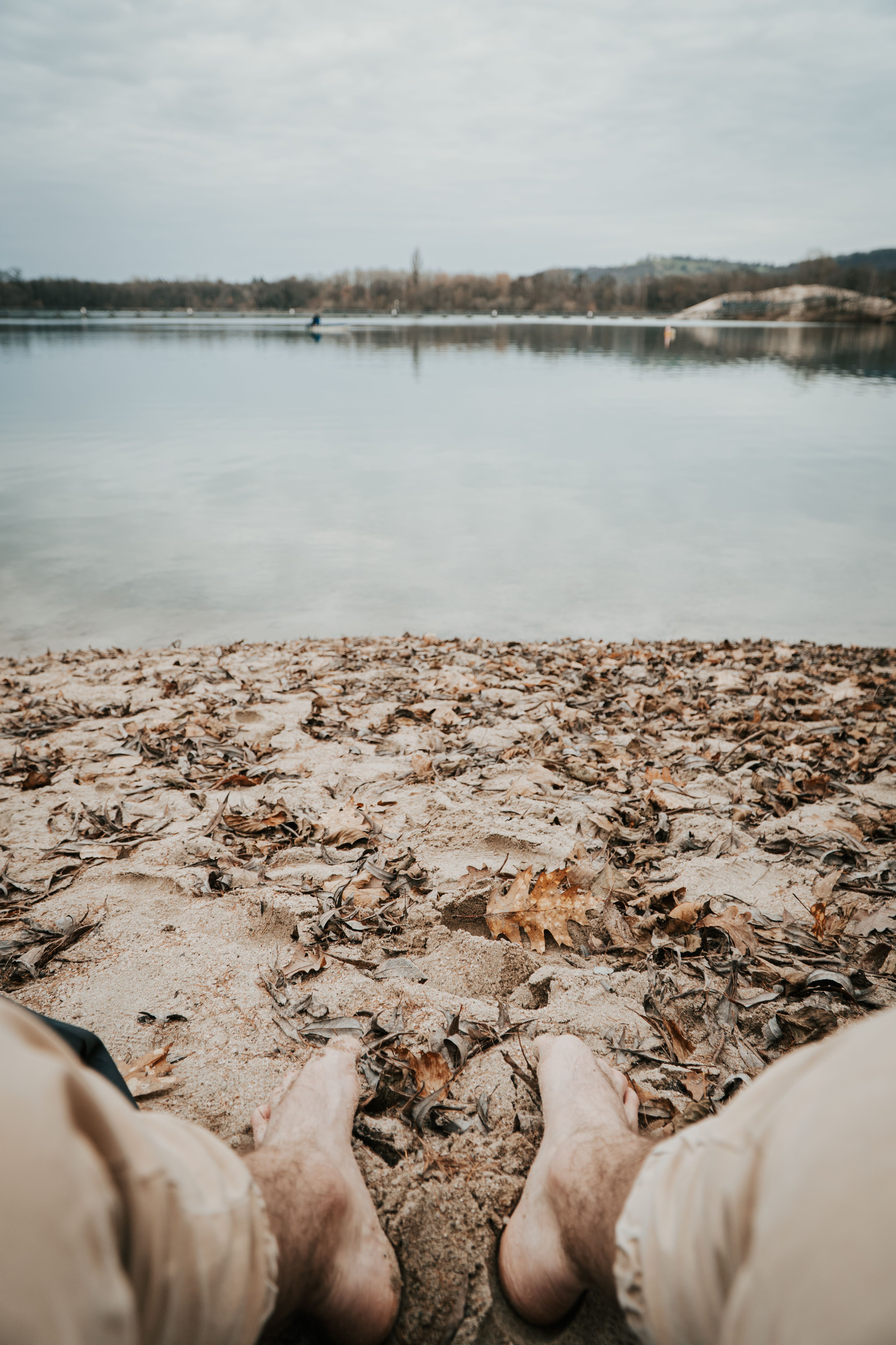 Man Legs from Personal Perspective on Lake Beach · Free Stock Photo