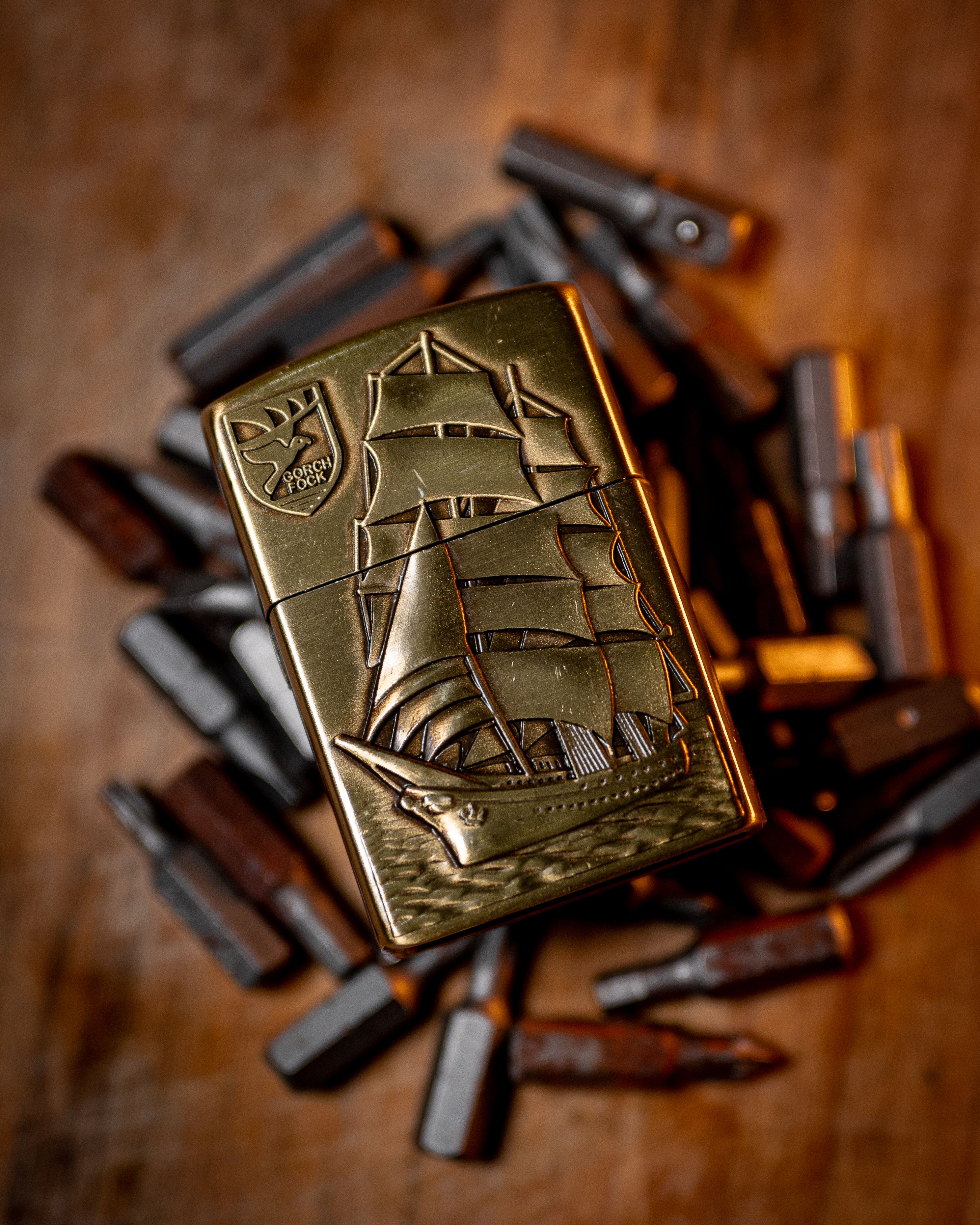 Close-Up Photograph of a Gold Zippo Lighter · Free Stock Photo
