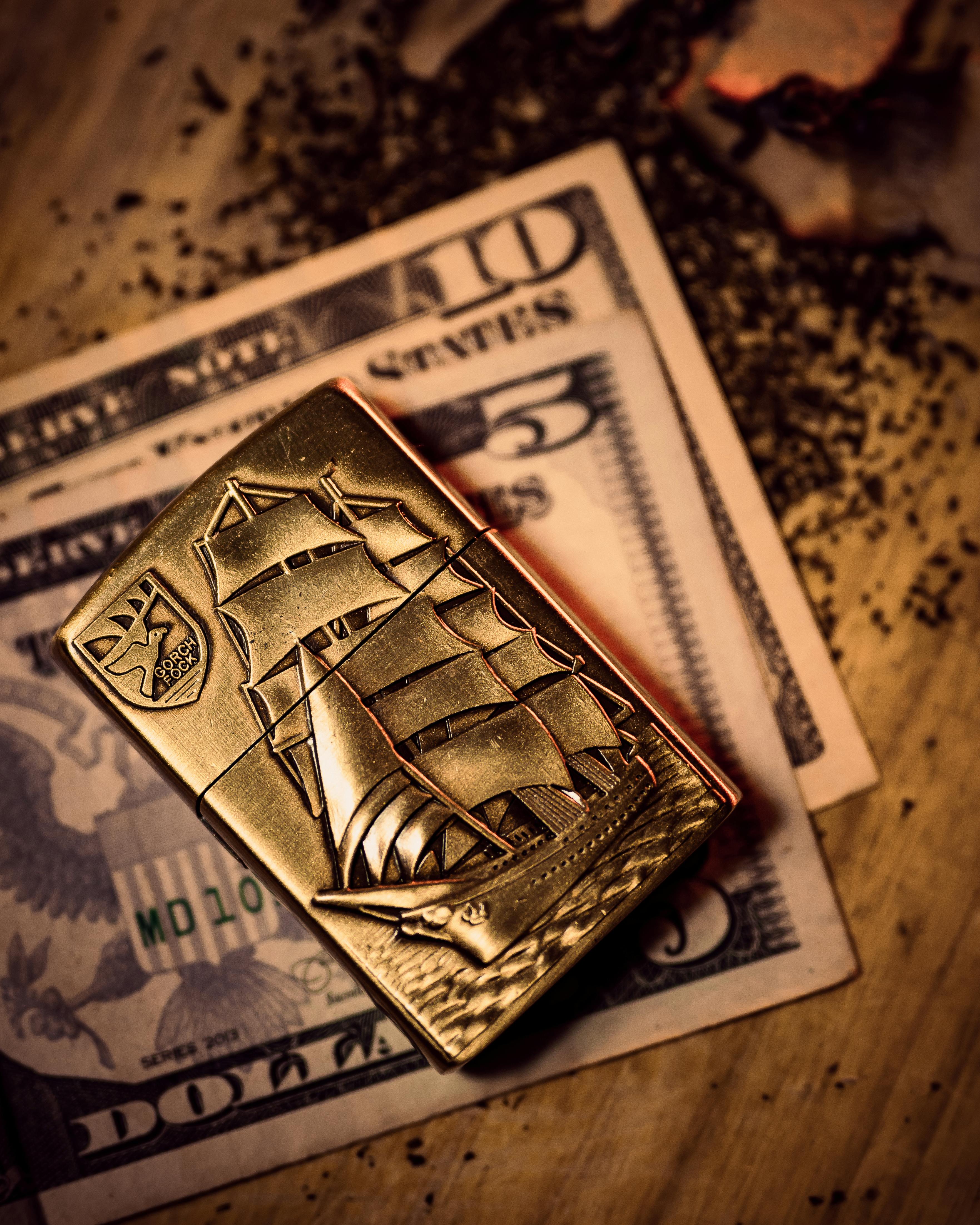 Decorated Lighter on Dollar Notes · Free Stock Photo