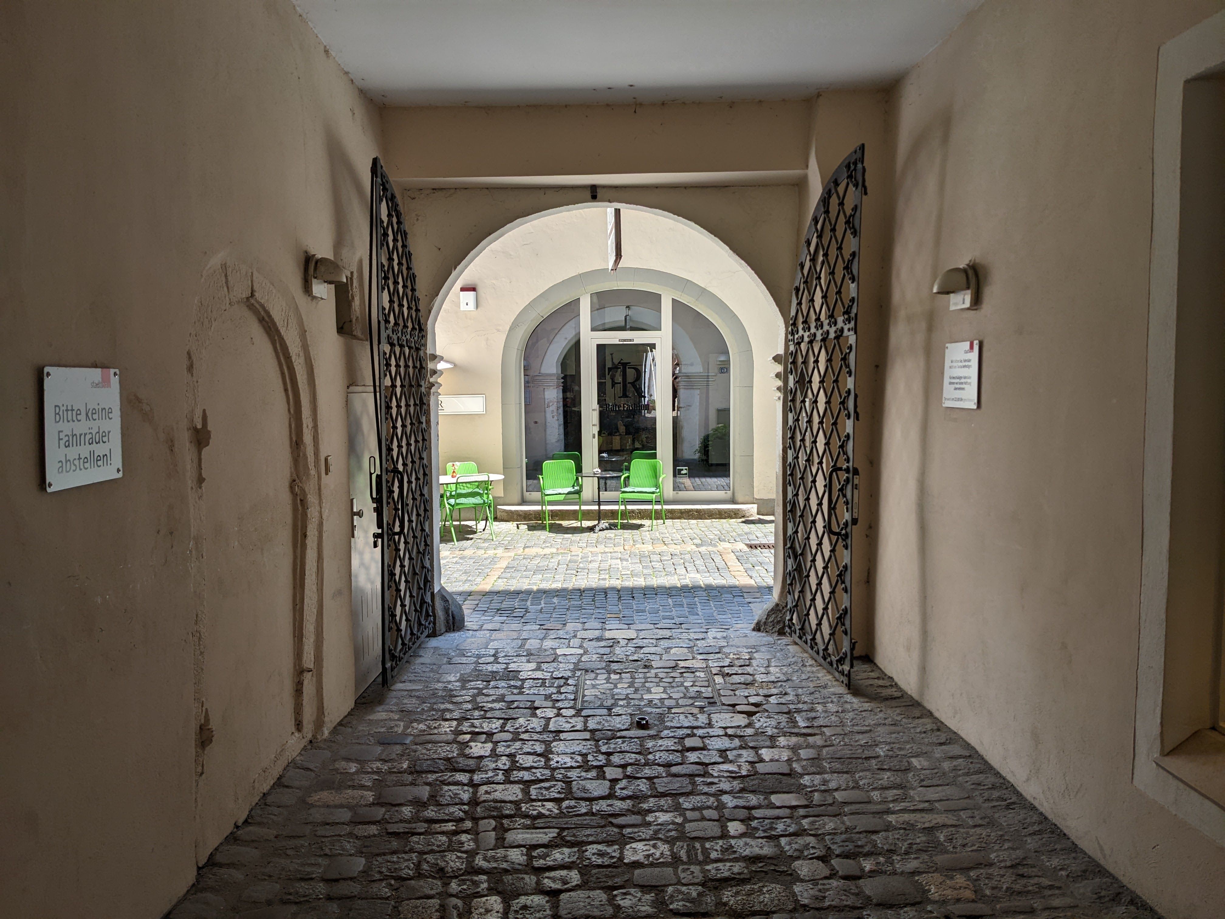 Walkway Through Gate into City Street · Free Stock Photo