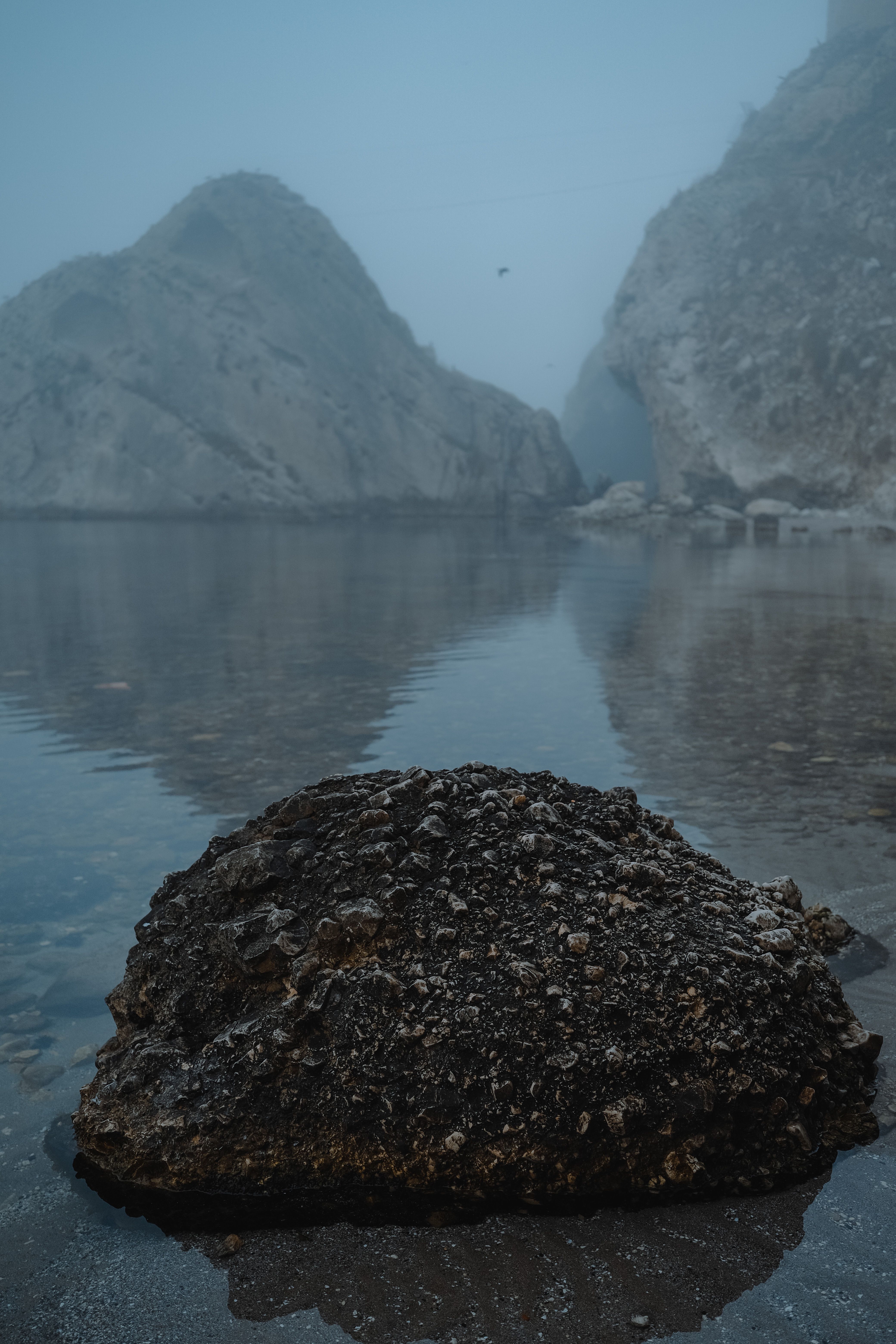Fog over Rock on Water · Free Stock Photo