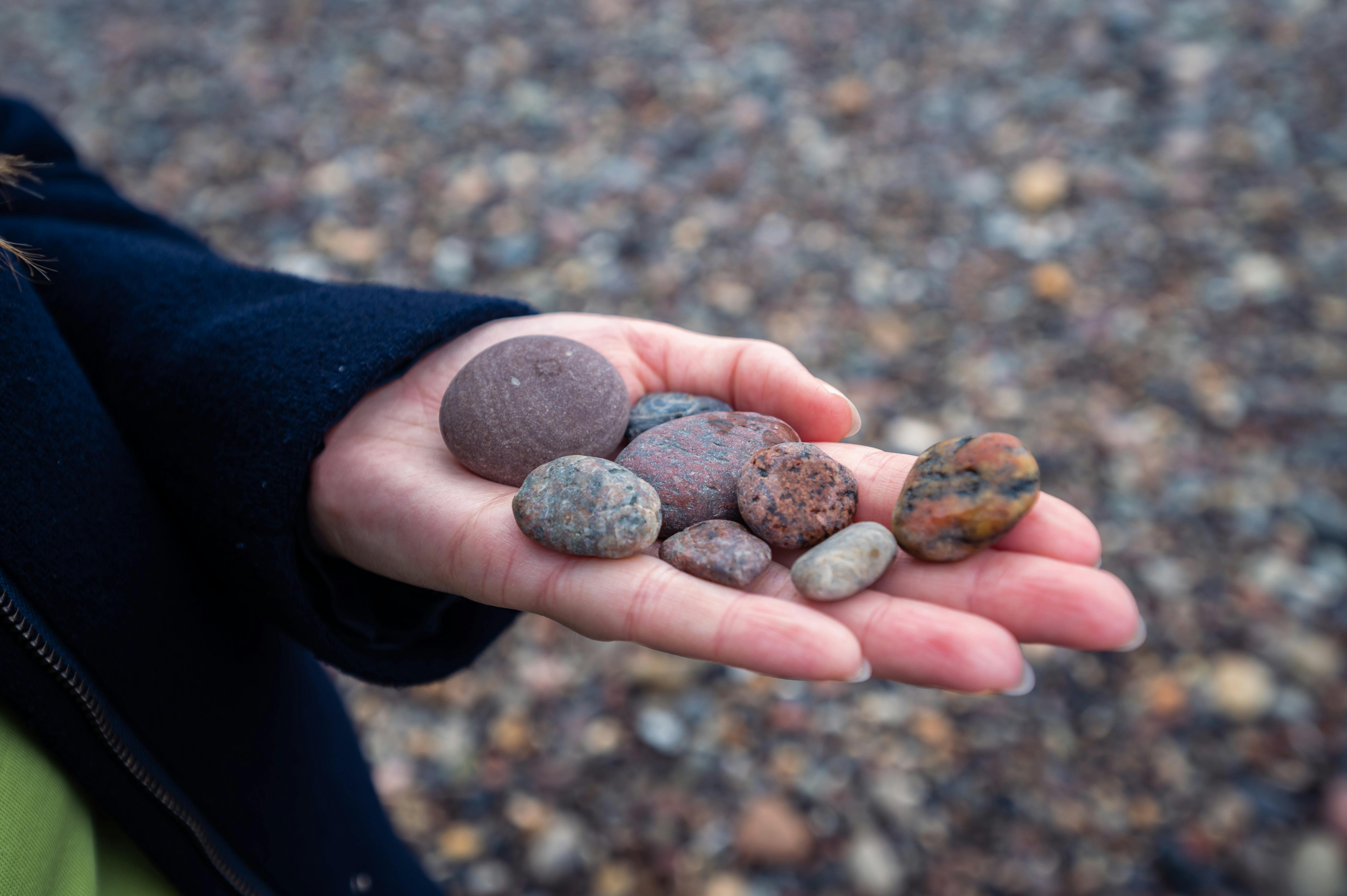 Photo of Stones on a Person's Hand · Free Stock Photo