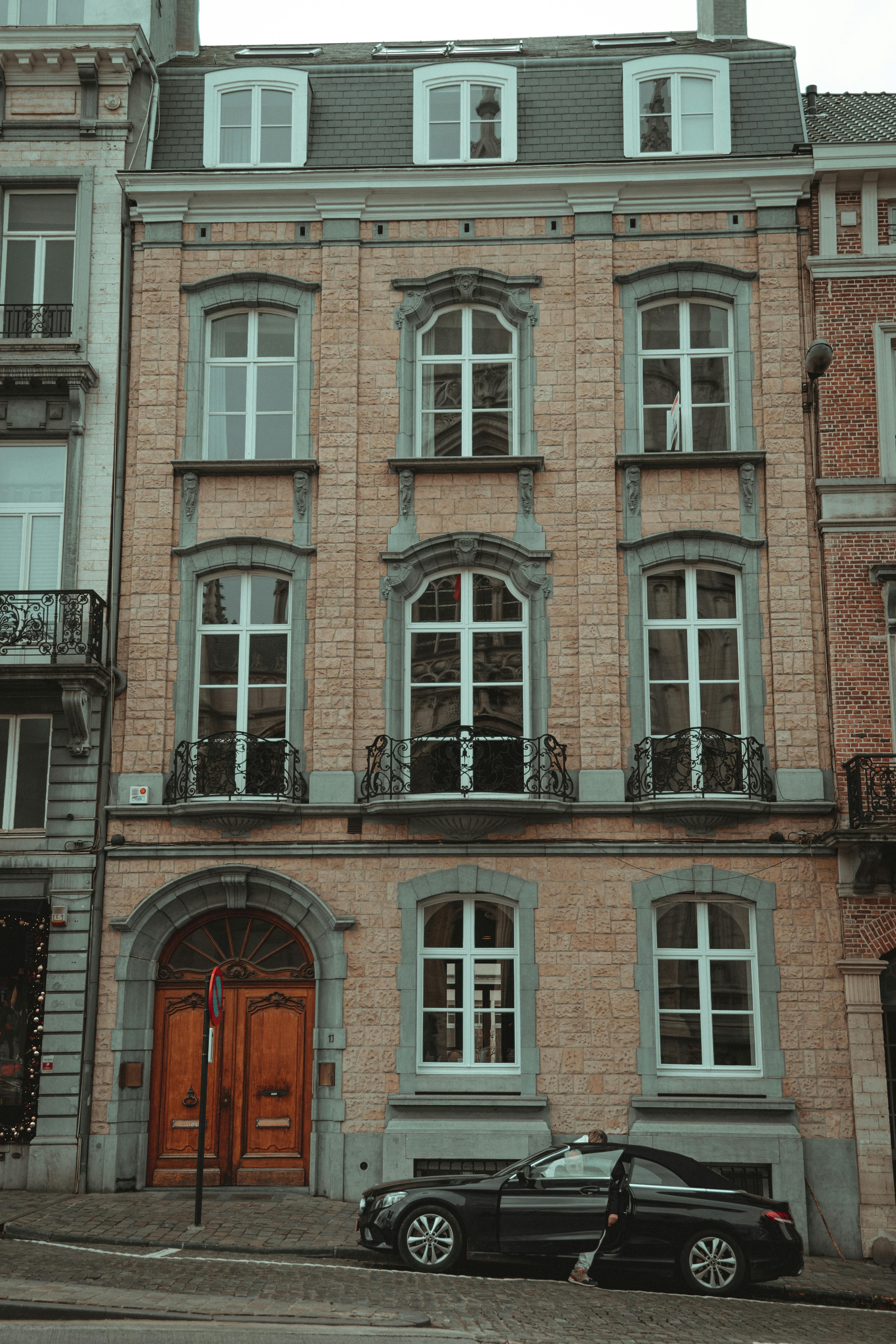 Car near Building in Town · Free Stock Photo