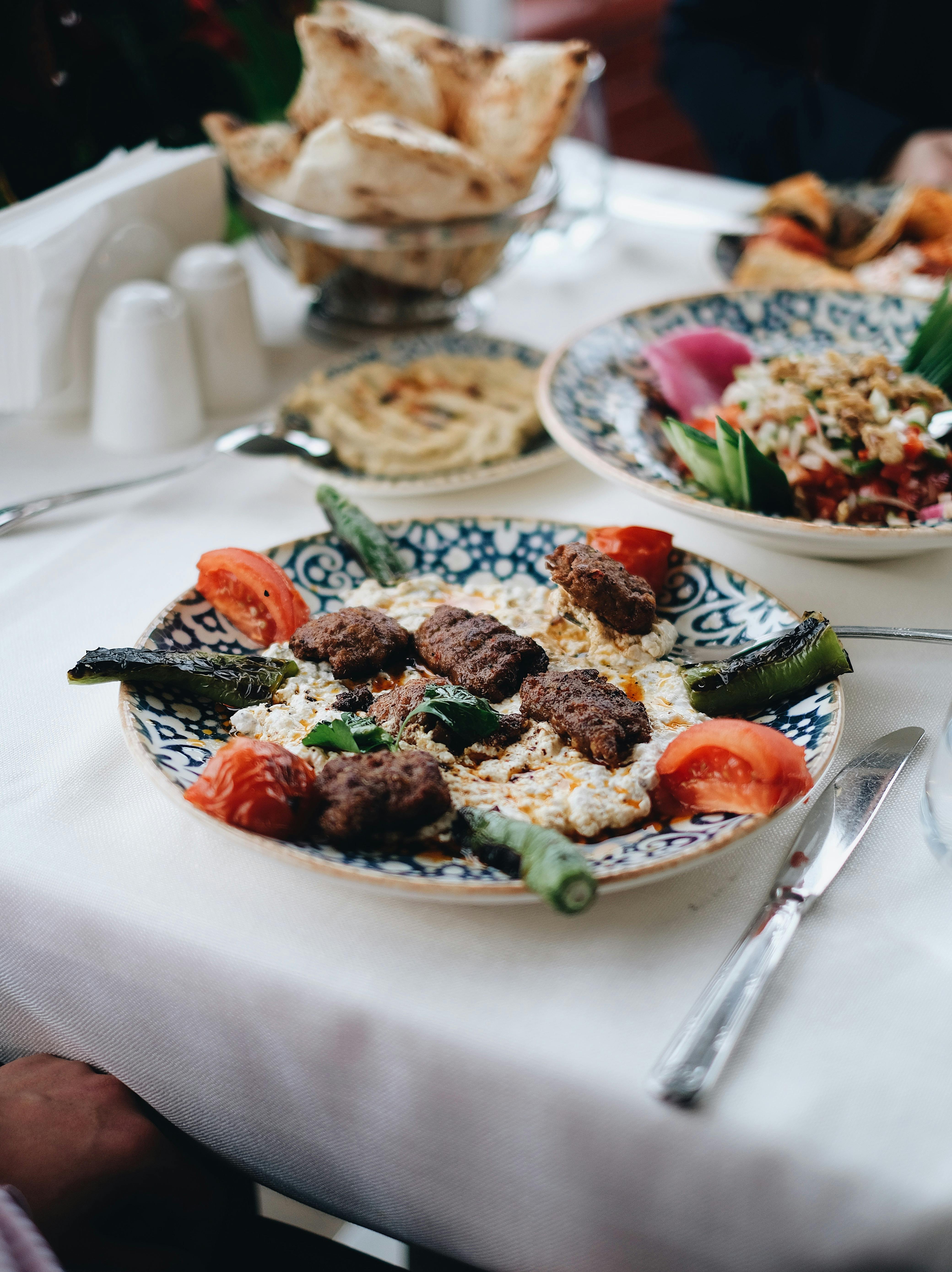 Delicious Dinner on a Table in a Restaurant · Free Stock Photo