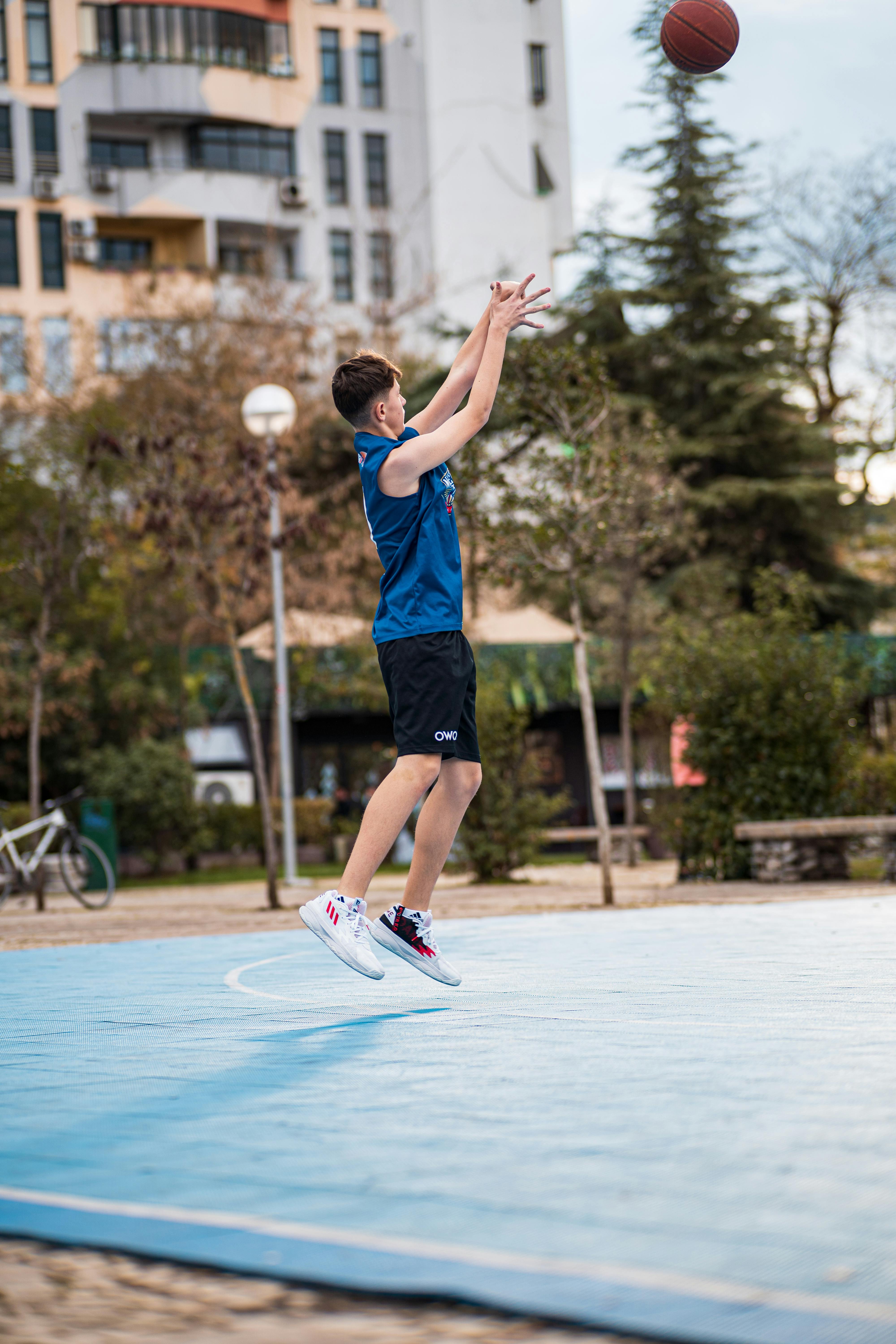 Man Shooting a Ball · Free Stock Photo