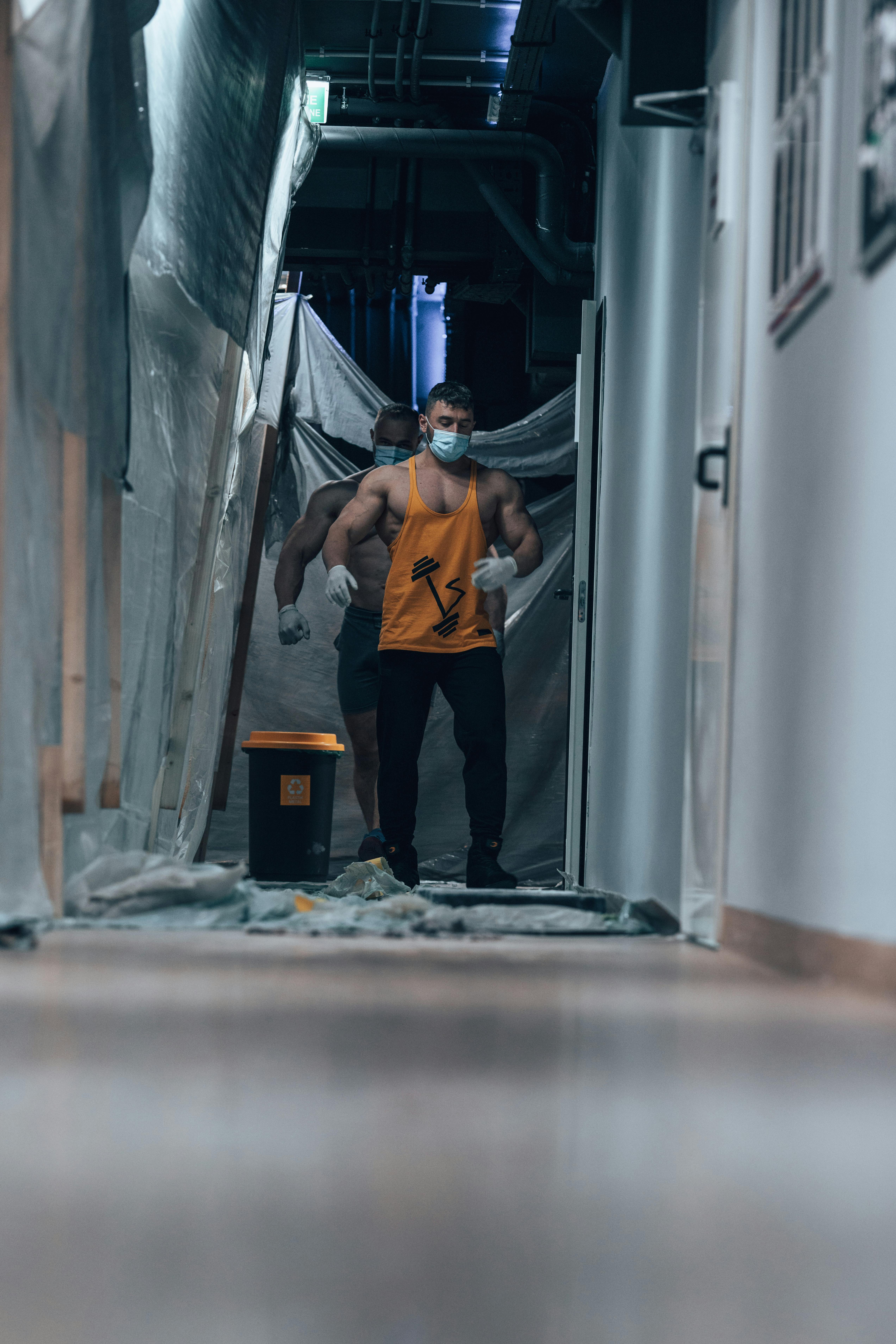 Muscular Men in Face Masks and Gloves · Free Stock Photo