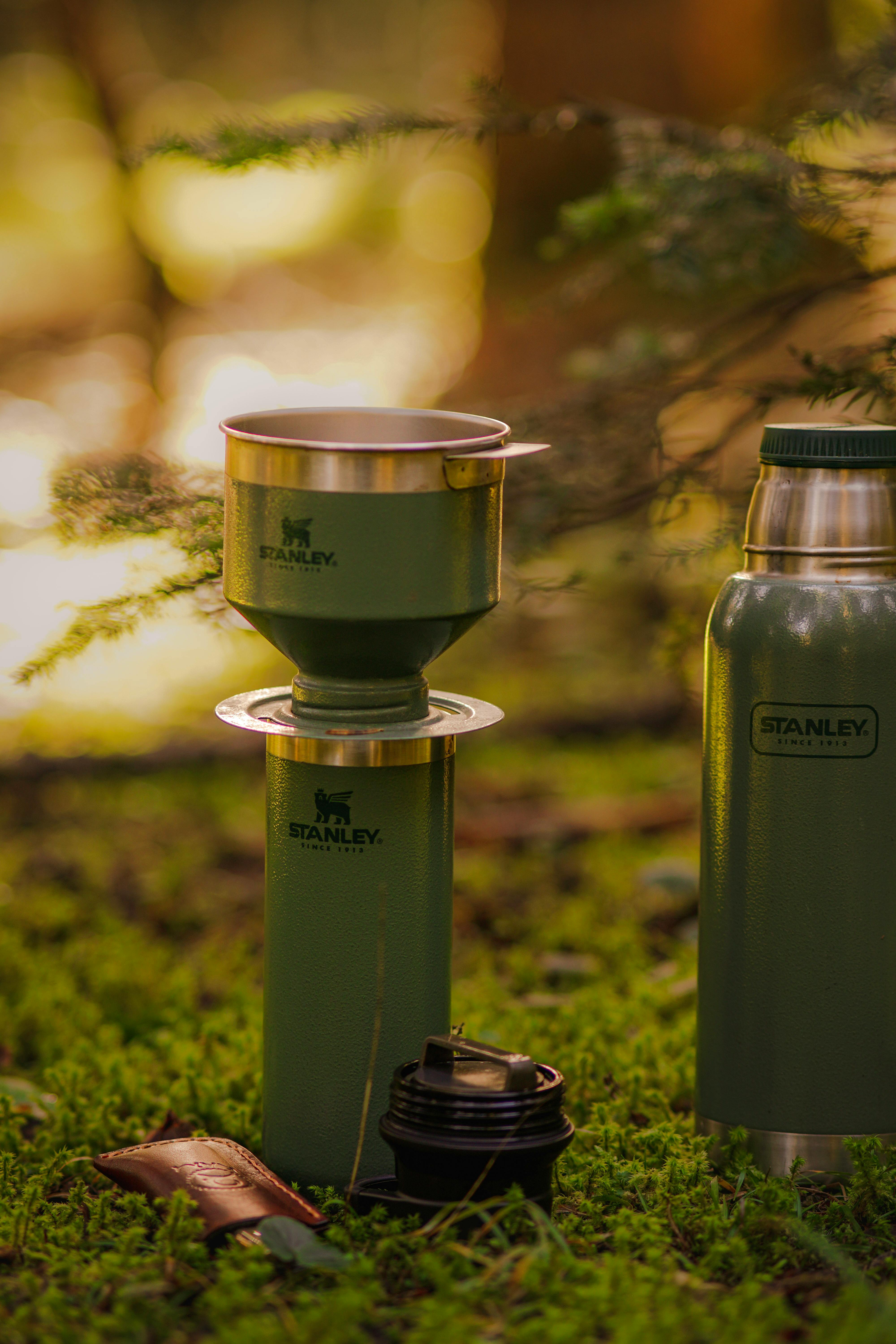 Thermos books and photo camera on camp tent · Free Stock Photo
