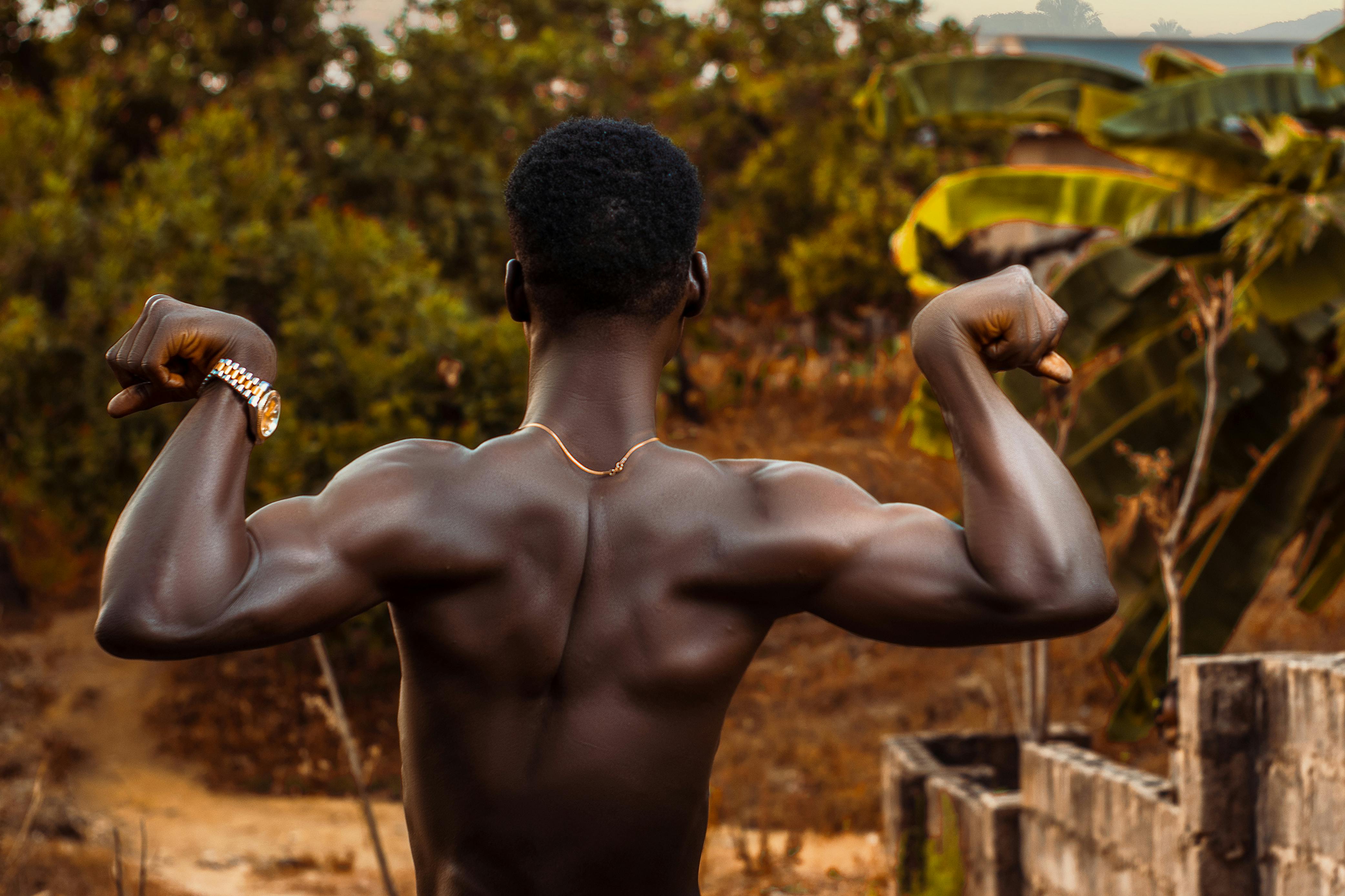 A Man Flexing His Muscles · Free Stock Photo
