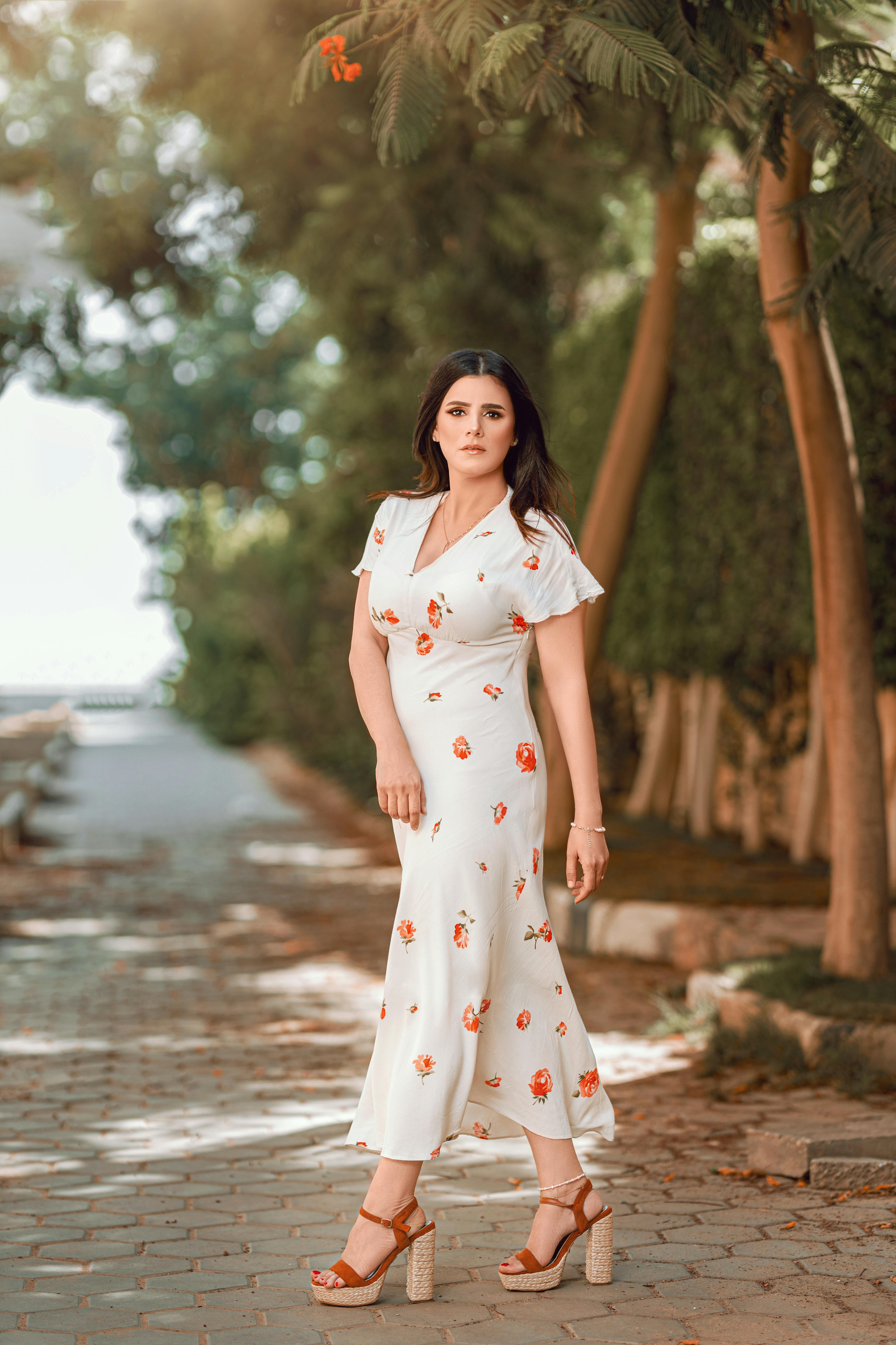 Woman Standing beside a Tree · Free Stock Photo