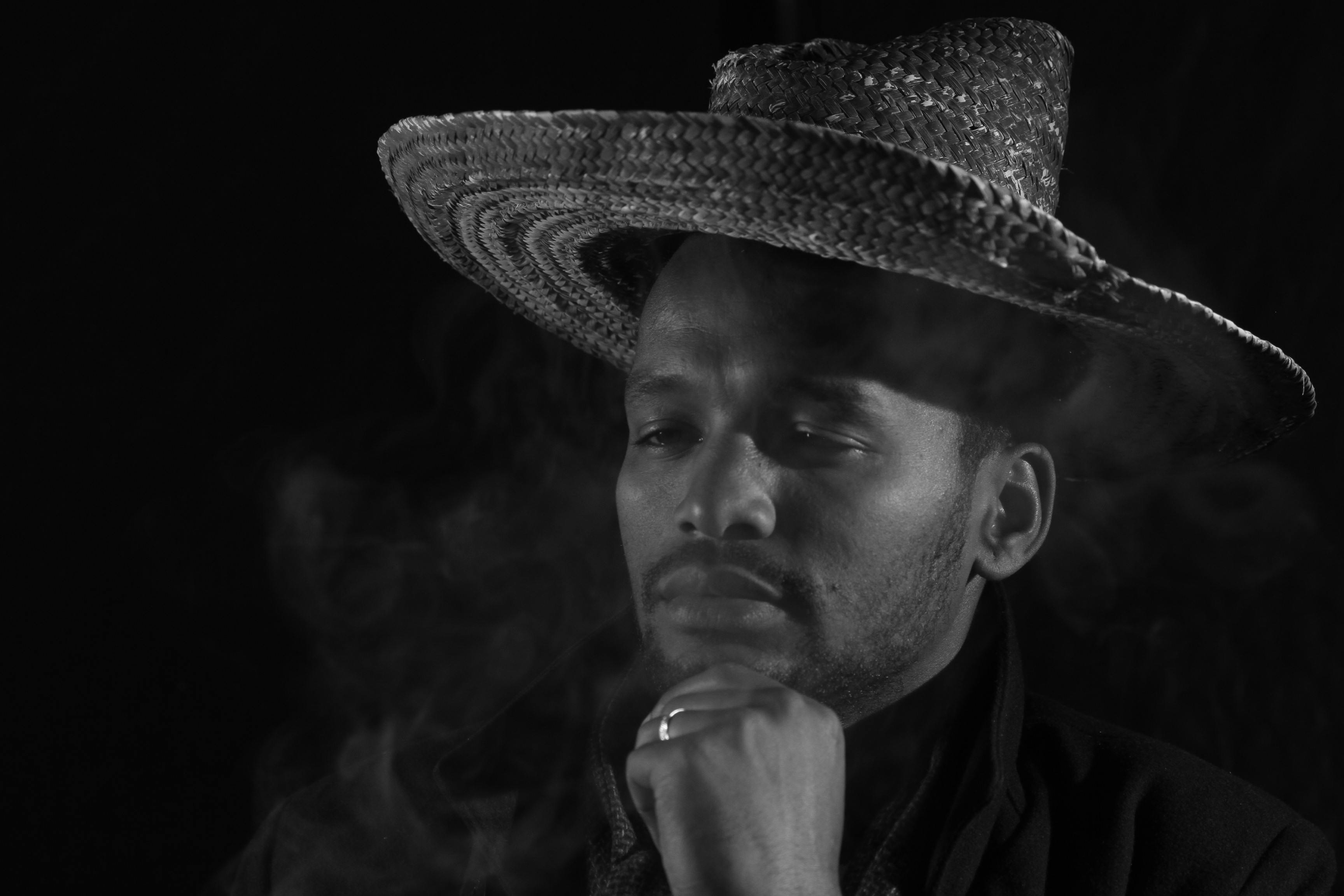 Grayscale Portrait Photo of Man Wearing Holding a Camera · Free Stock Photo