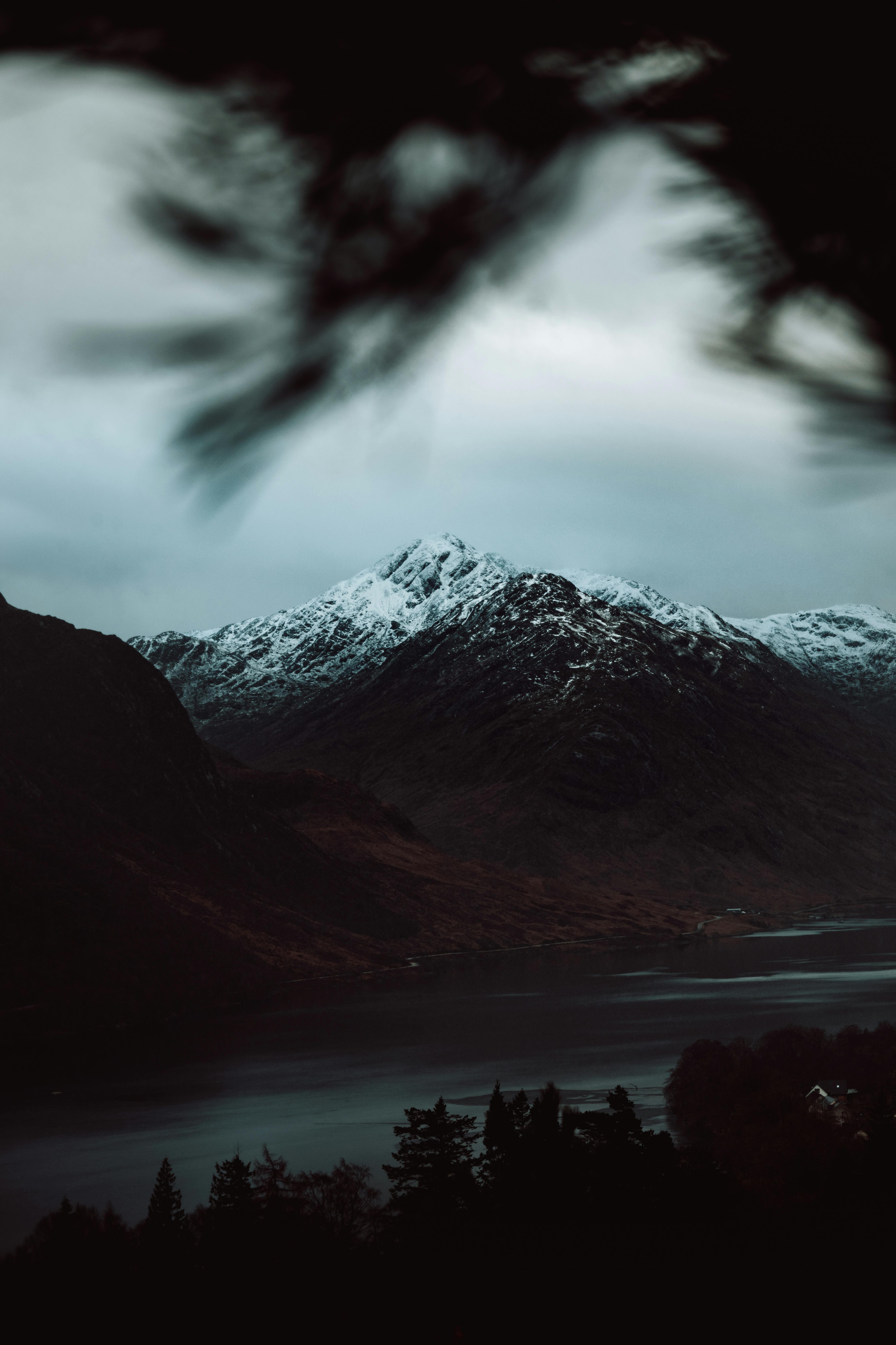 Snow Capped Mountain under Gloomy Sky · Free Stock Photo