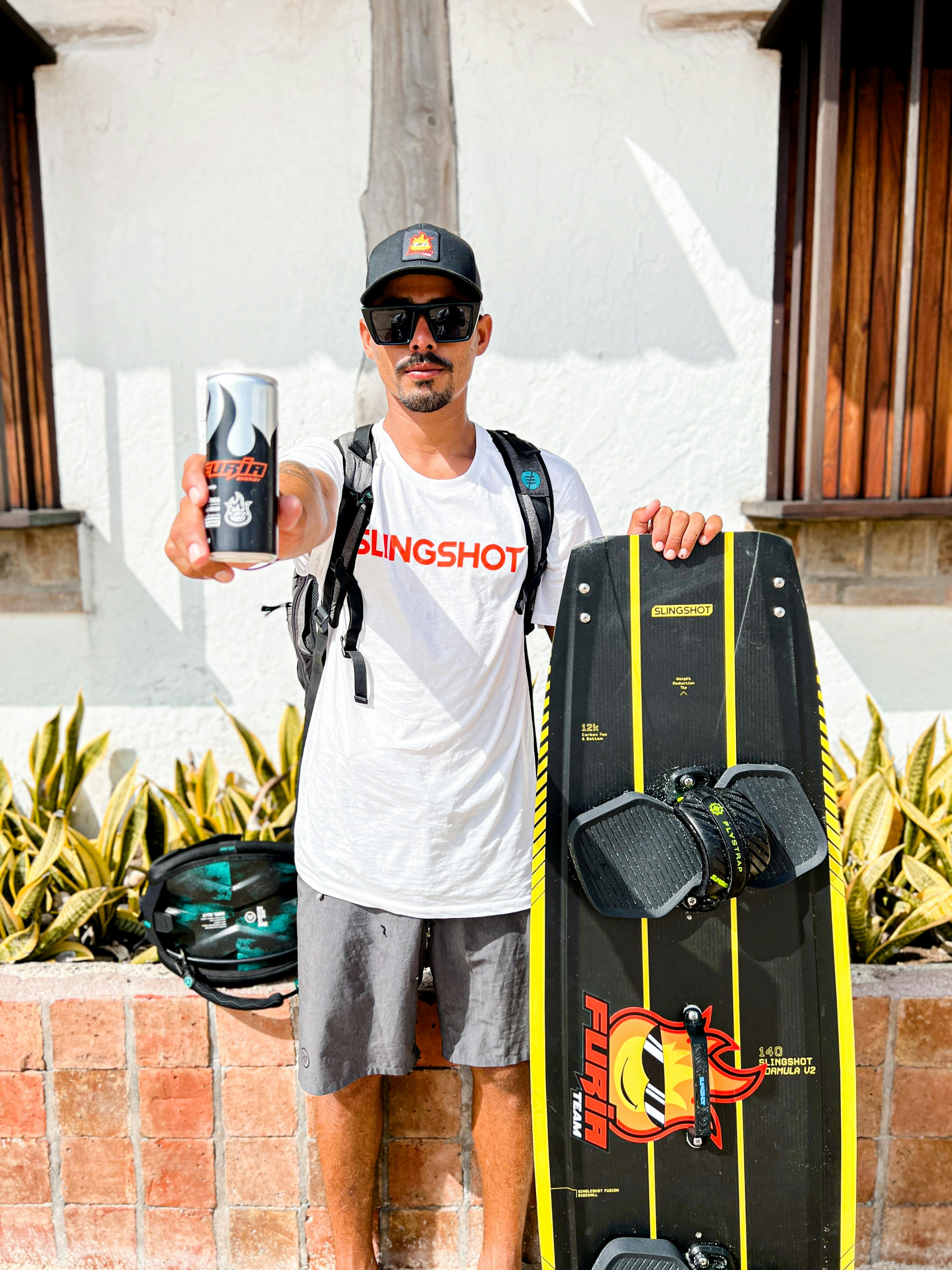 Person Holding Red Bull Energy Drink Can · Free Stock Photo