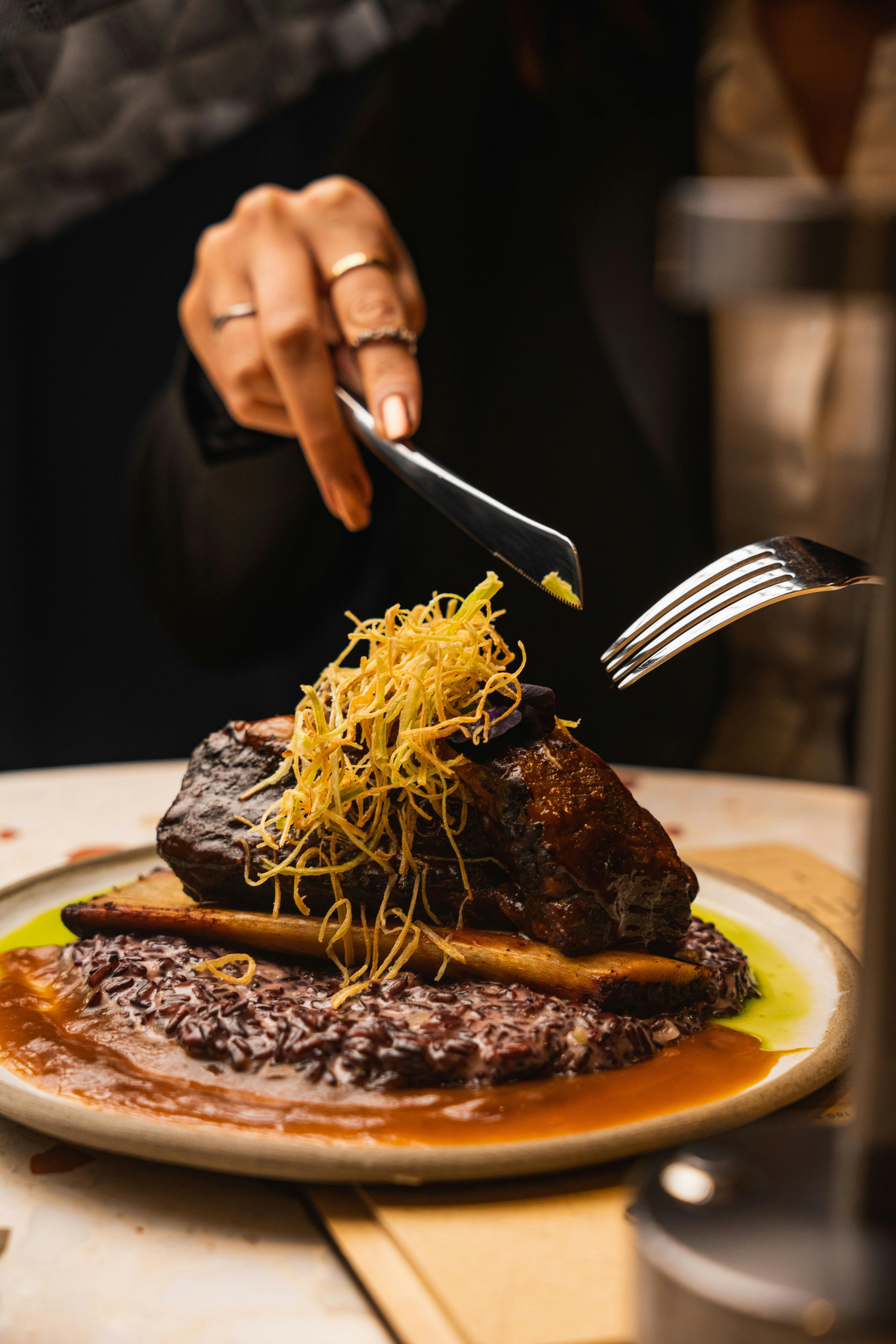 A Person Eating Meat · Free Stock Photo