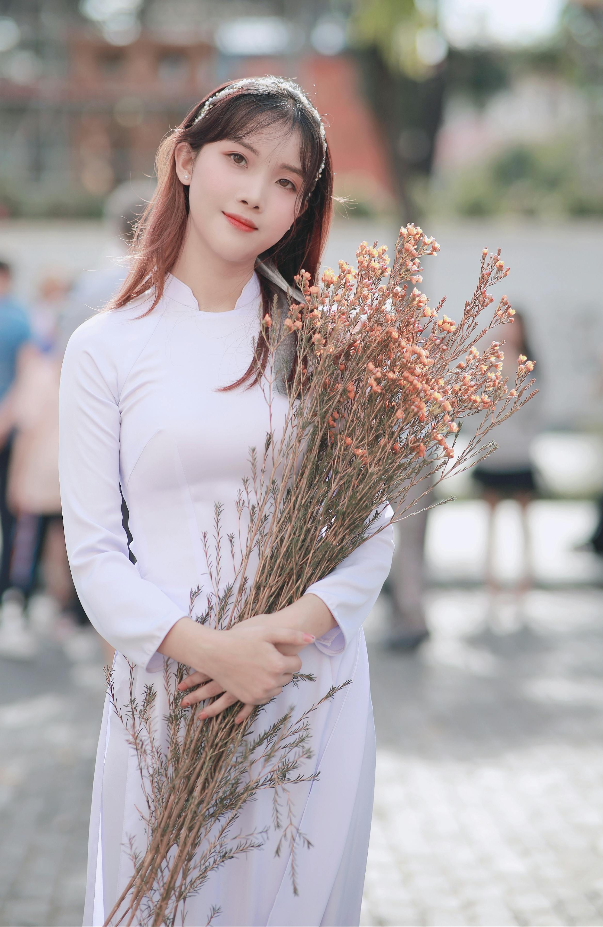 Pretty Woman Wearing a White Traditional Dress · Free Stock Photo