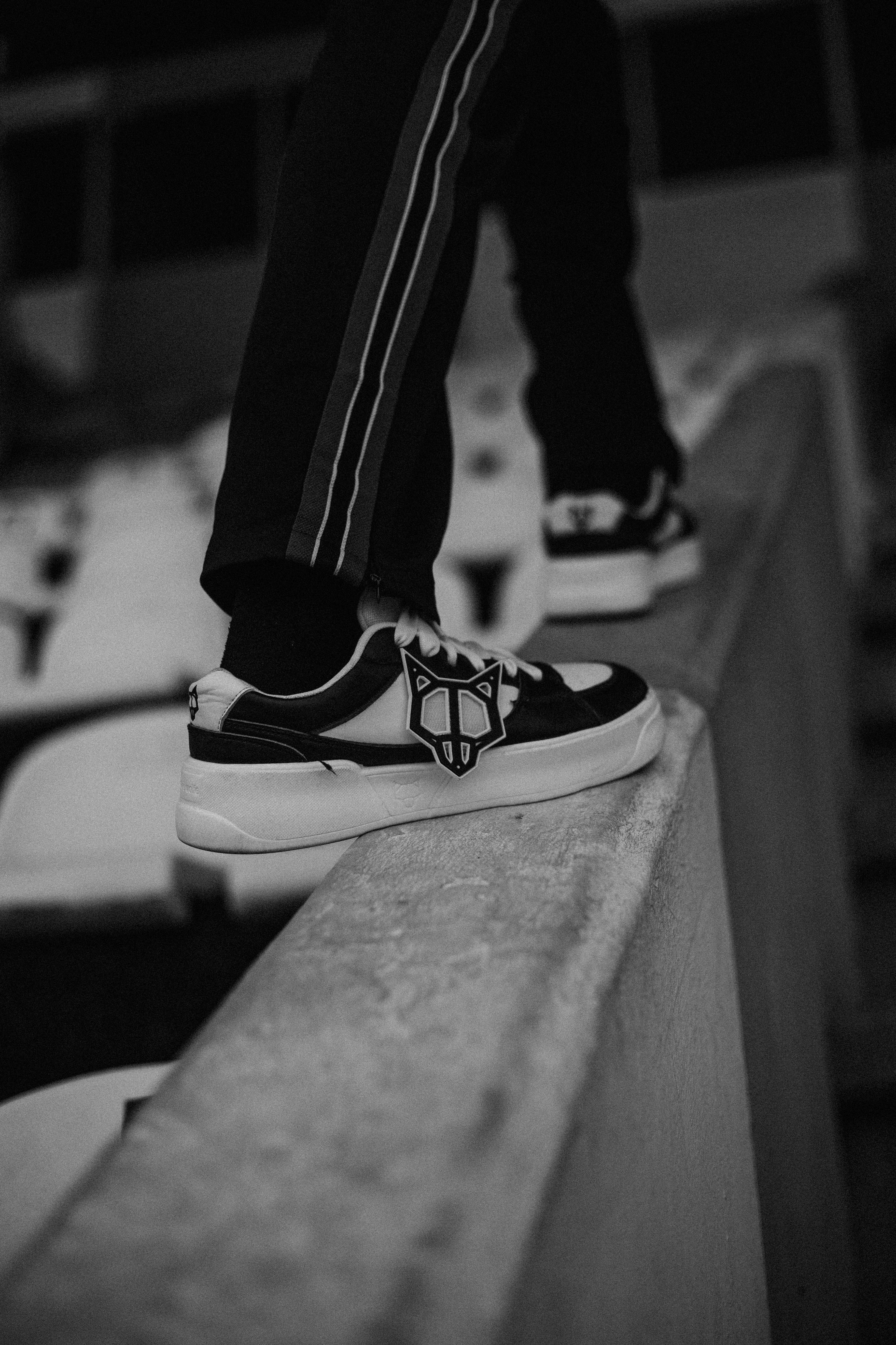A Grayscale Photo of a Sneakers · Free Stock Photo