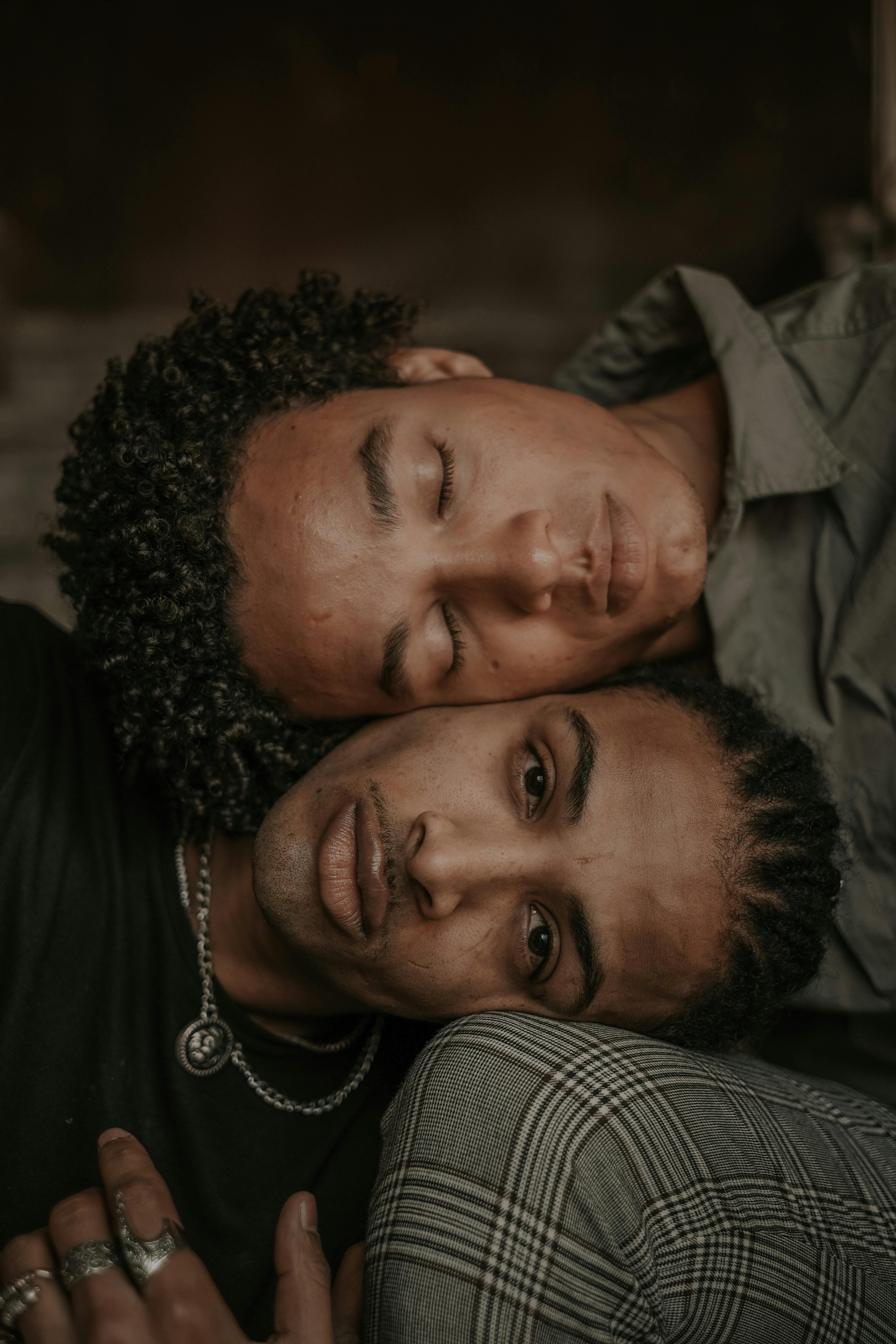 Two Men with their Heads Together and Closed Eyes · Free Stock Photo