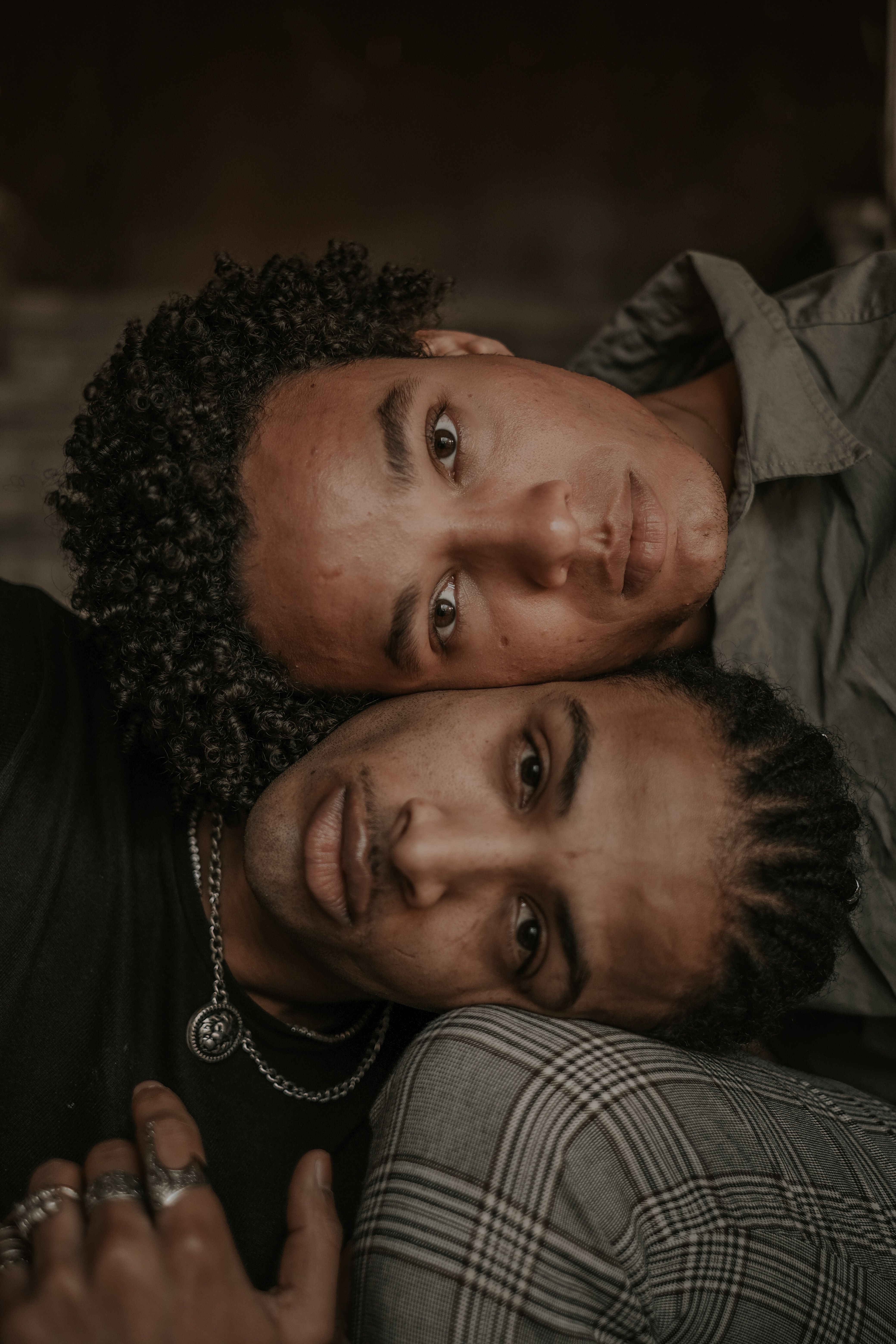 Two Men with their Heads Together and Closed Eyes · Free Stock Photo