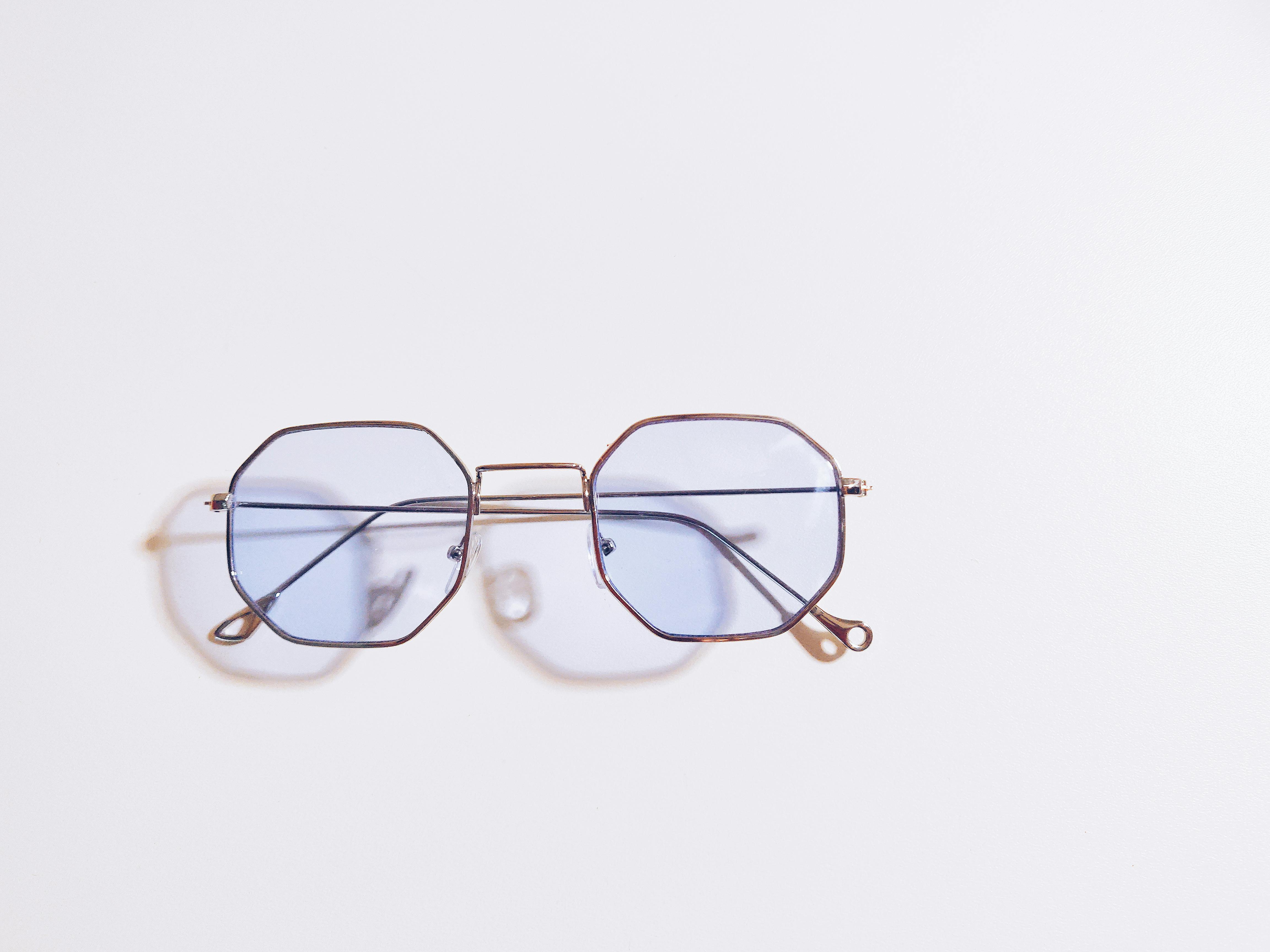 Eyeglasses On White Surface · Free Stock Photo